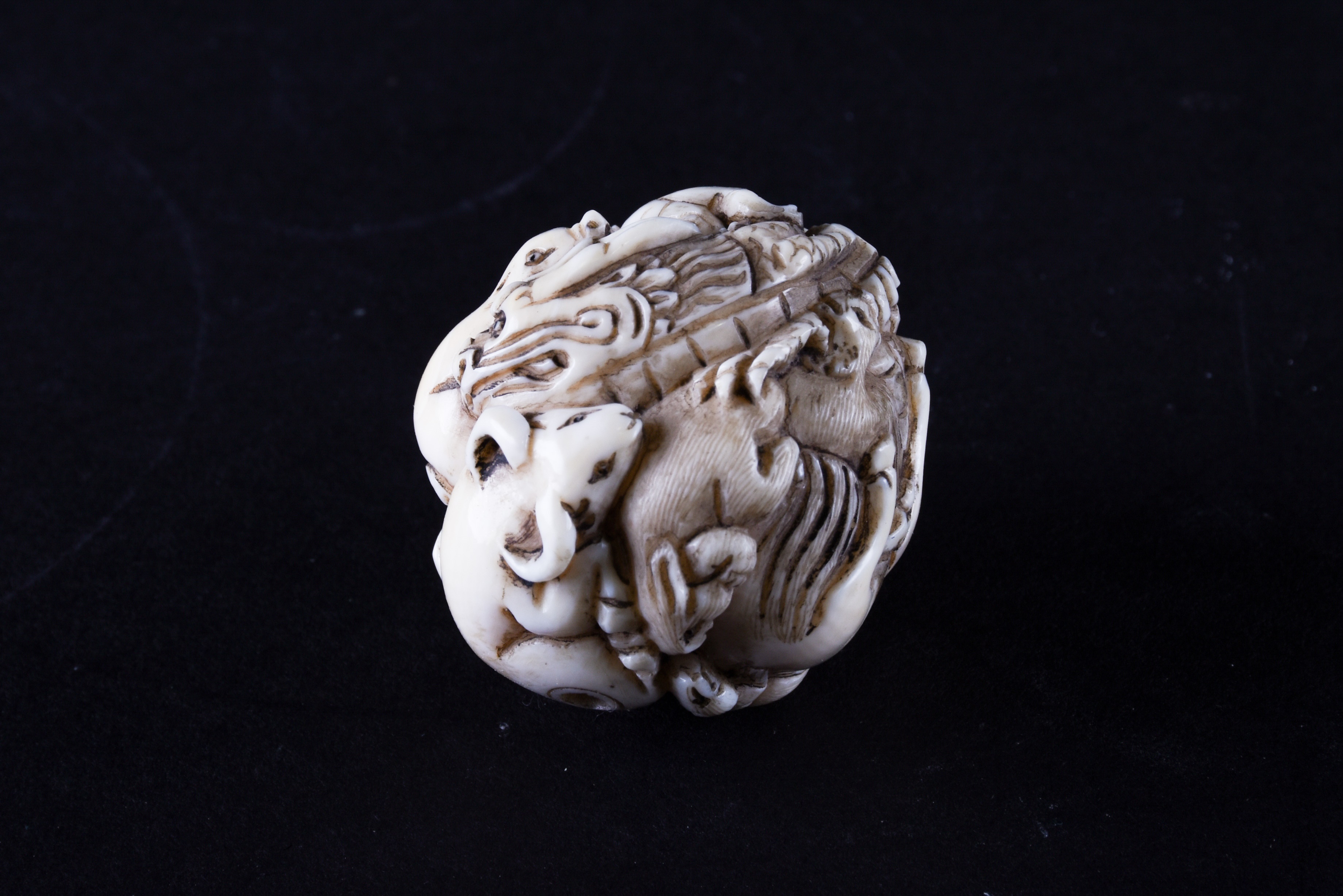 Lot 141 - A Japanese ivory zodiac ball netsuke, late