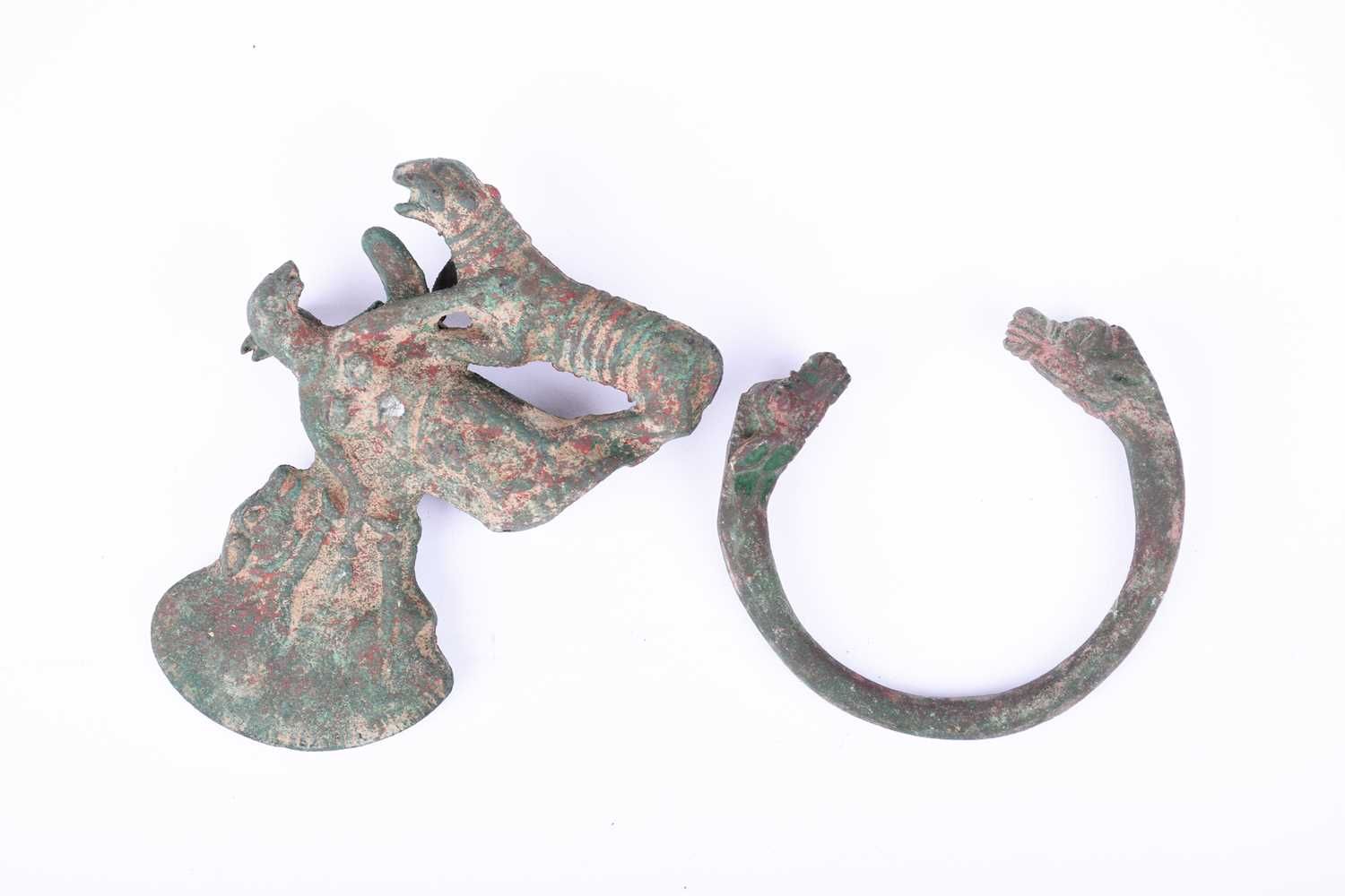 Lot 314 - An unusual cast metal axe head, cast as a