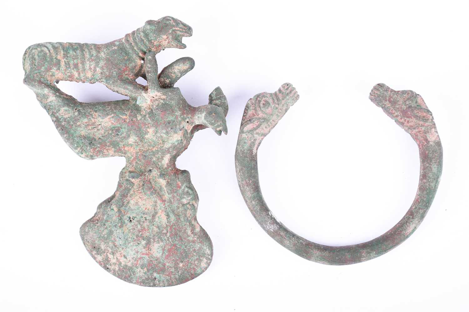 Lot 314 - An unusual cast metal axe head, cast as a