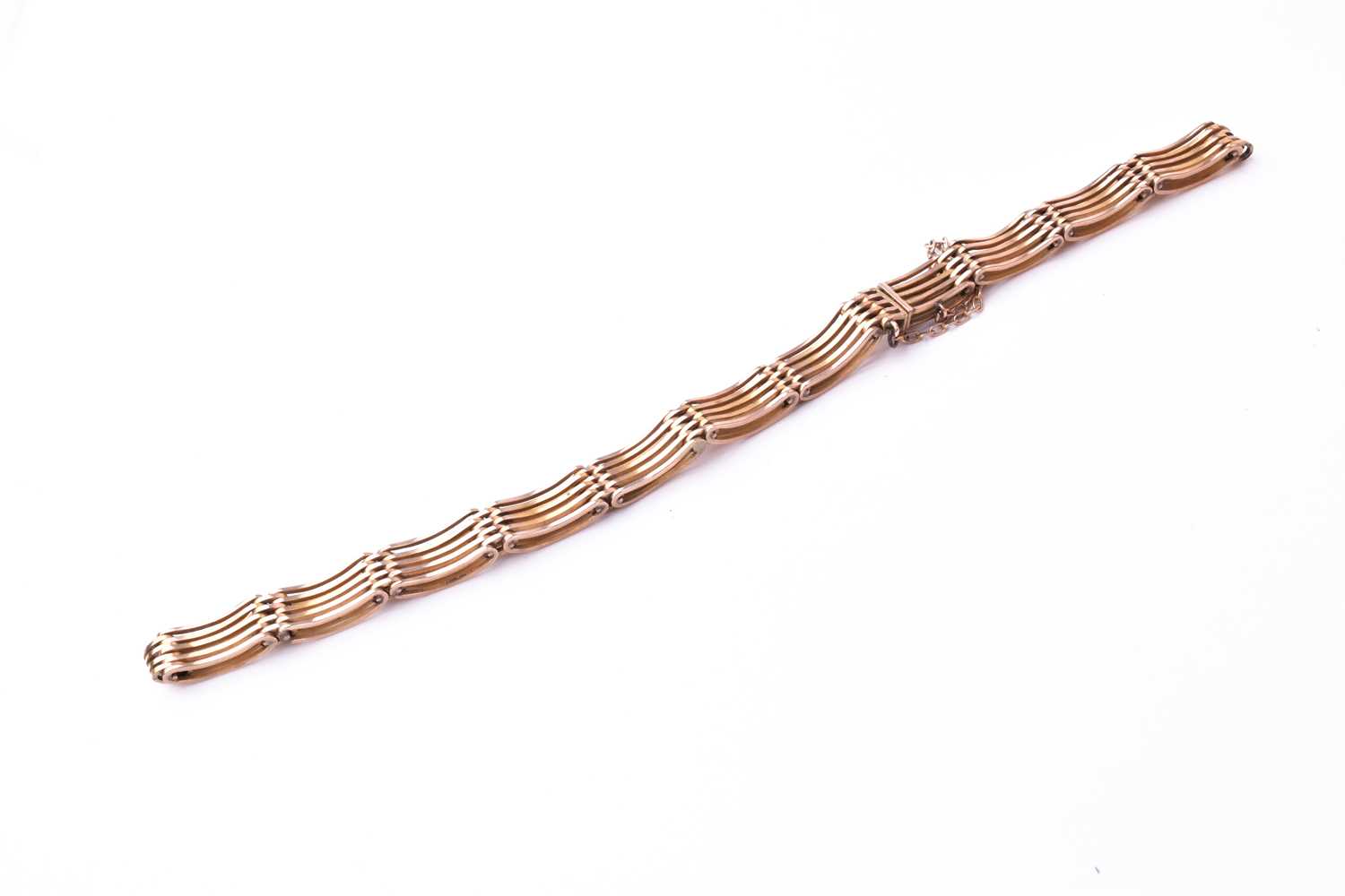 Lot 716 - A 9ct yellow gold curved segment bracelet