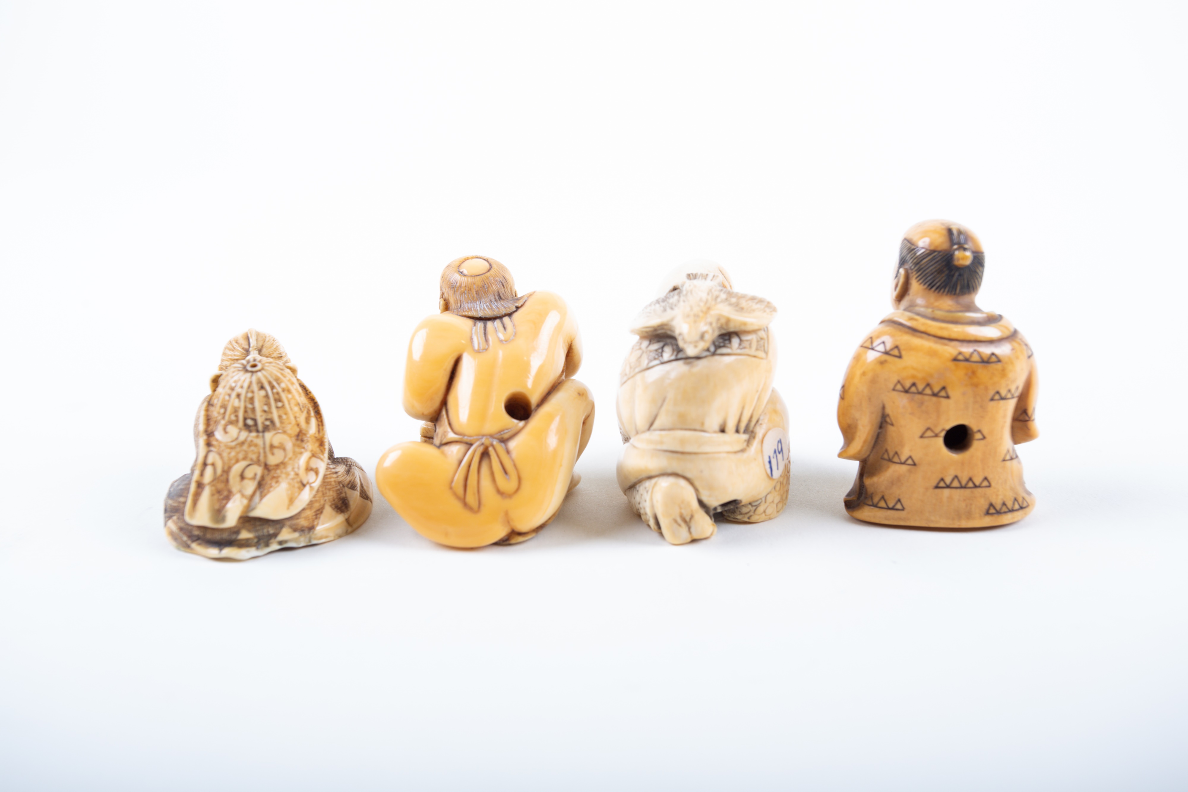 Lot 130 - Four Japanese carved ivory netsukes, Meiji