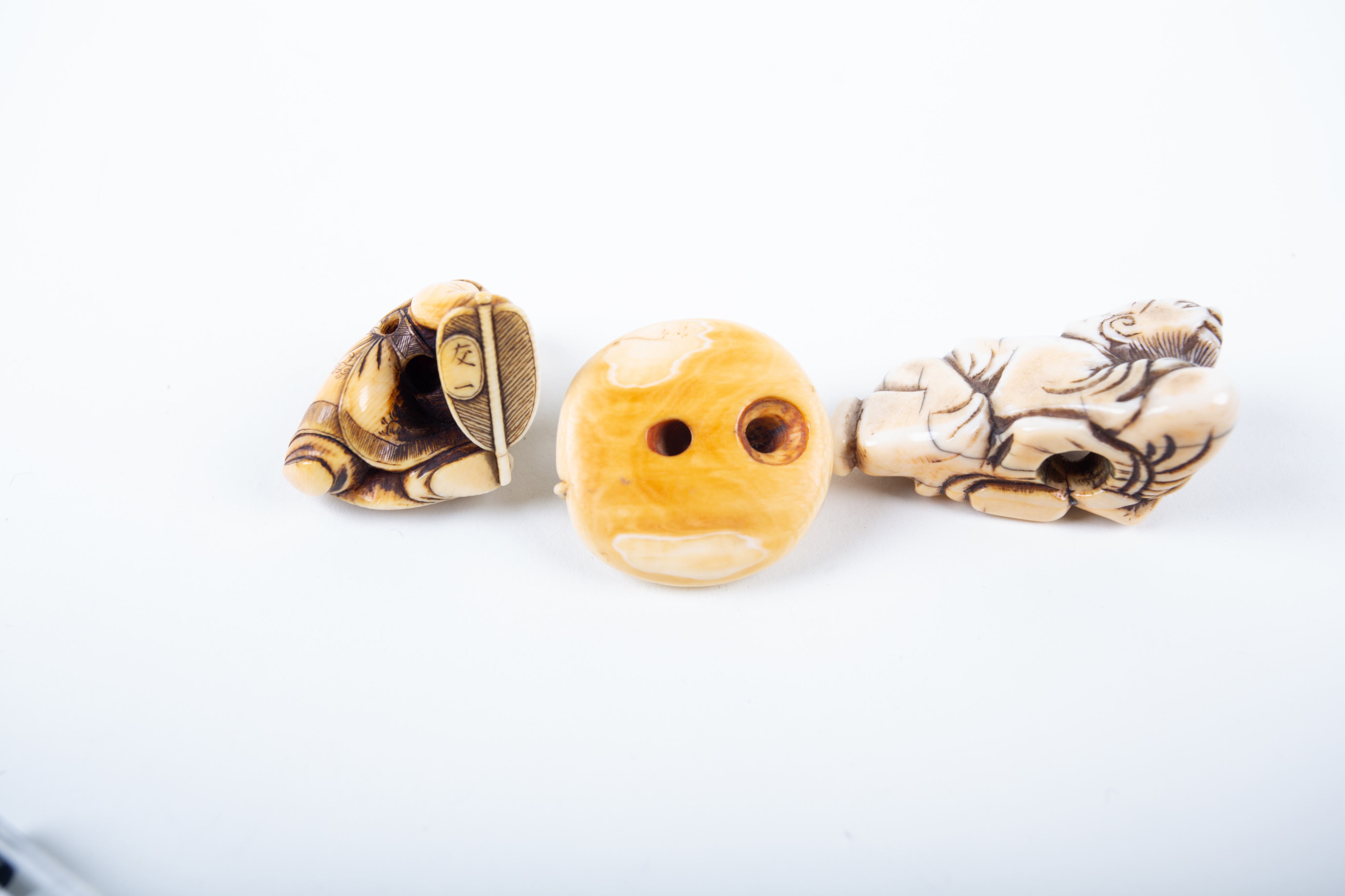 Lot 129 - Three Japanese ivory netsukes, Meiji period,