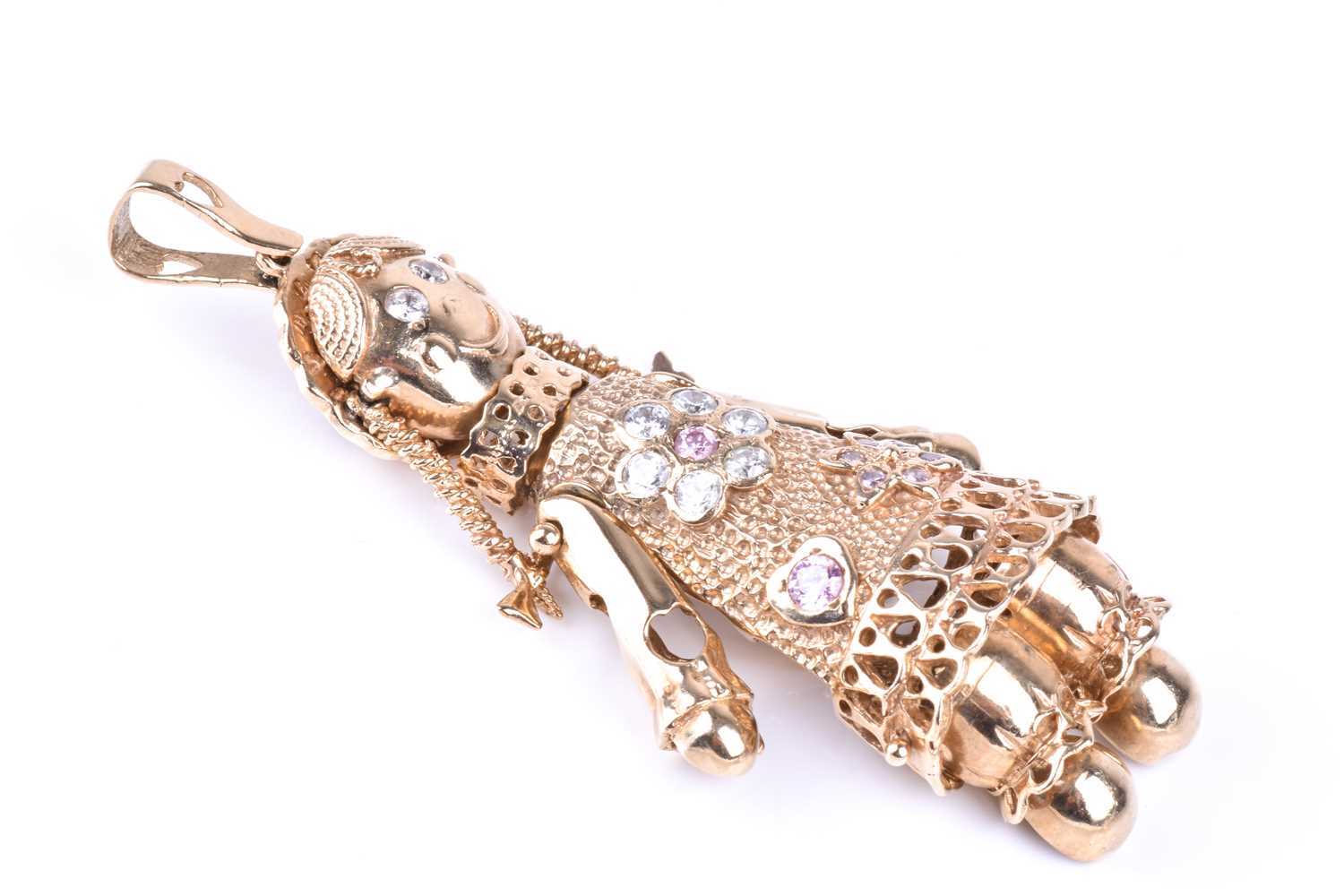 Lot 411 - An articulated 9ct gold rag doll pendant,