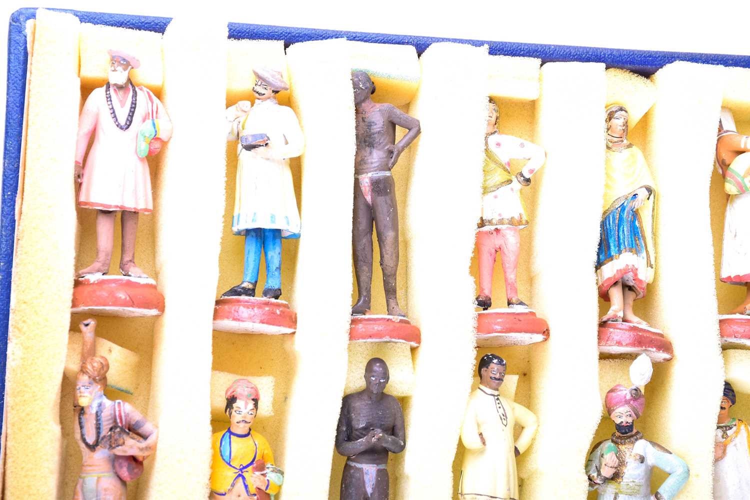 Lot 289 - a boxed collection of painted plaster Indian