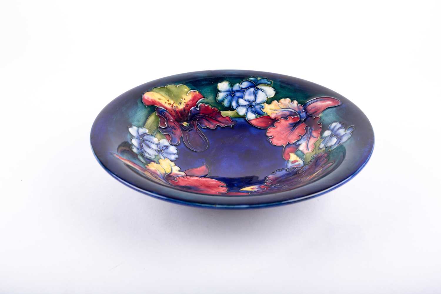 Lot 396 - A Walter Moorcroft open dish in the Orchid