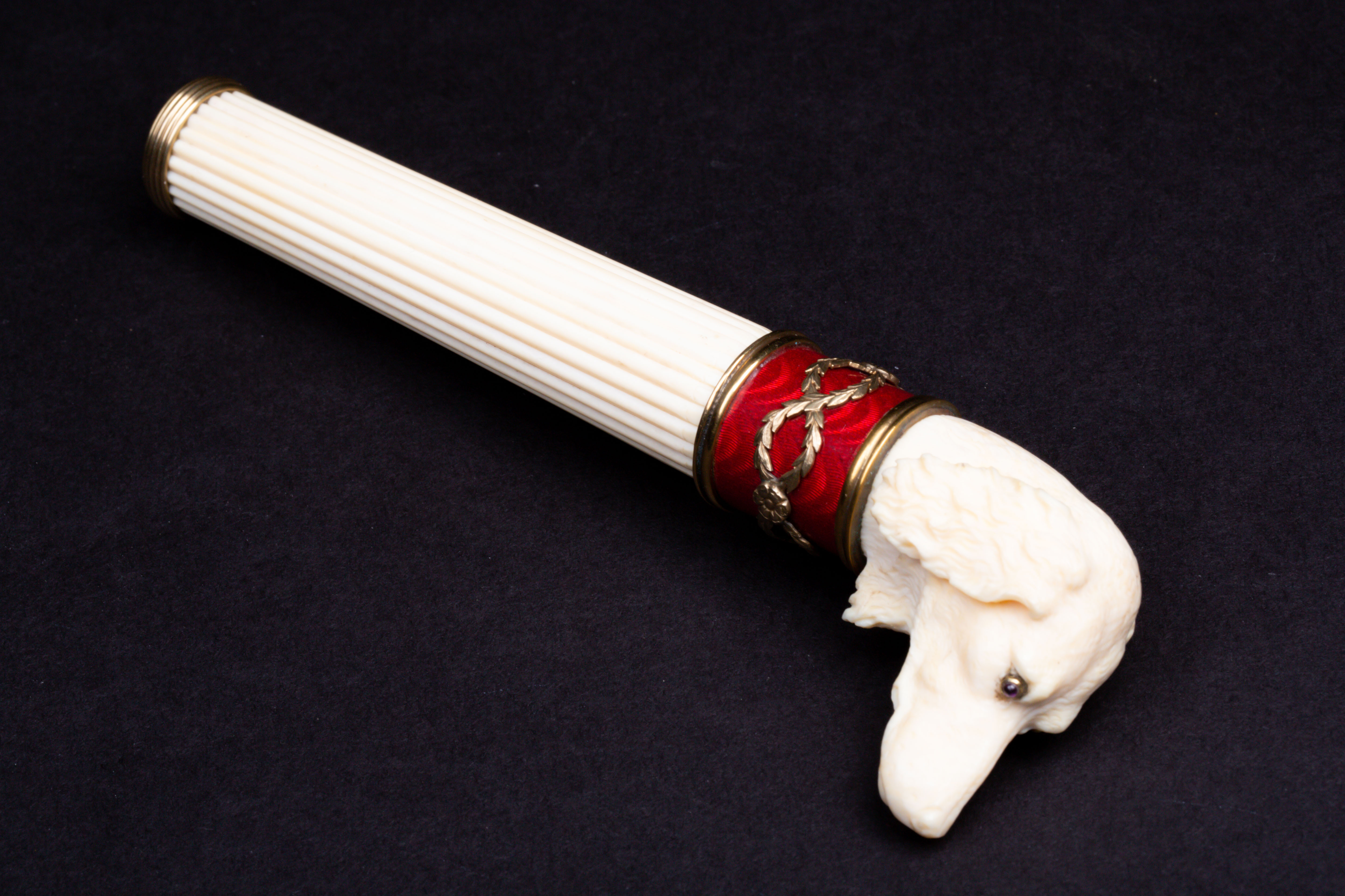 Lot 290 - A Russian carved ivory parasol handle, well
