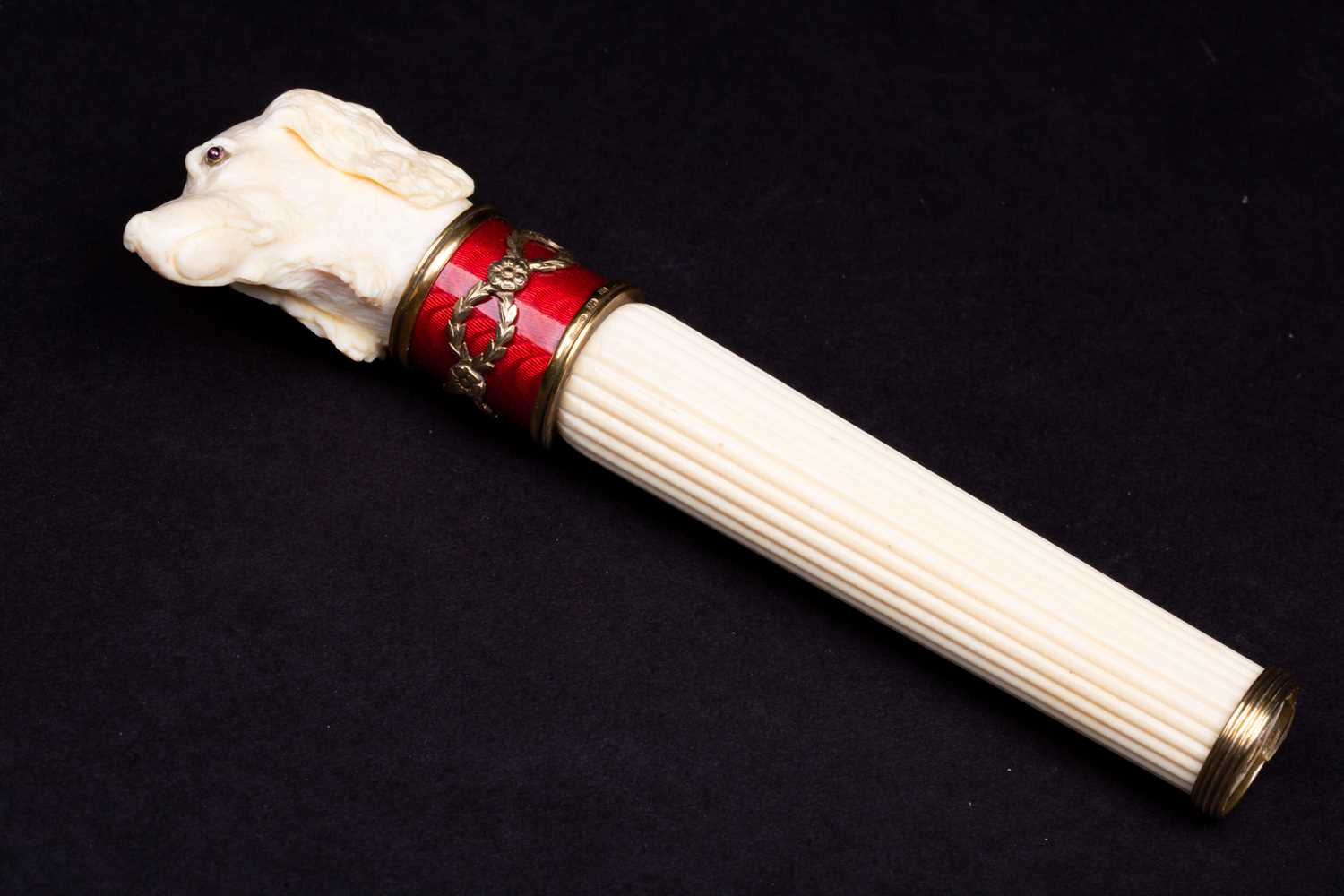 Lot 290 - A Russian carved ivory parasol handle, well