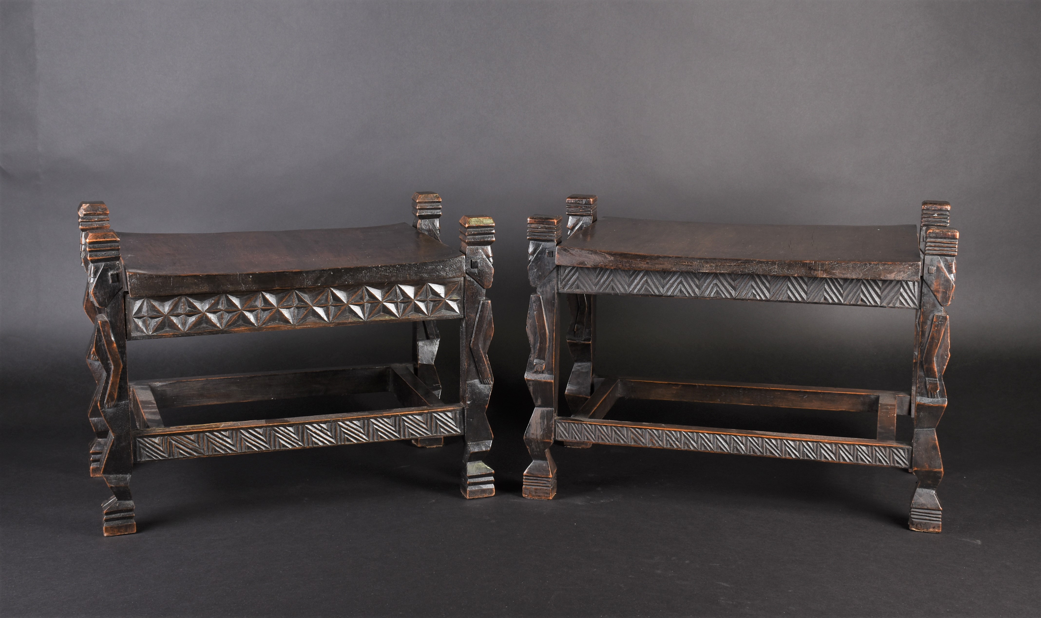 Lot 126 - A near pair of Rwandan carved wood stools,