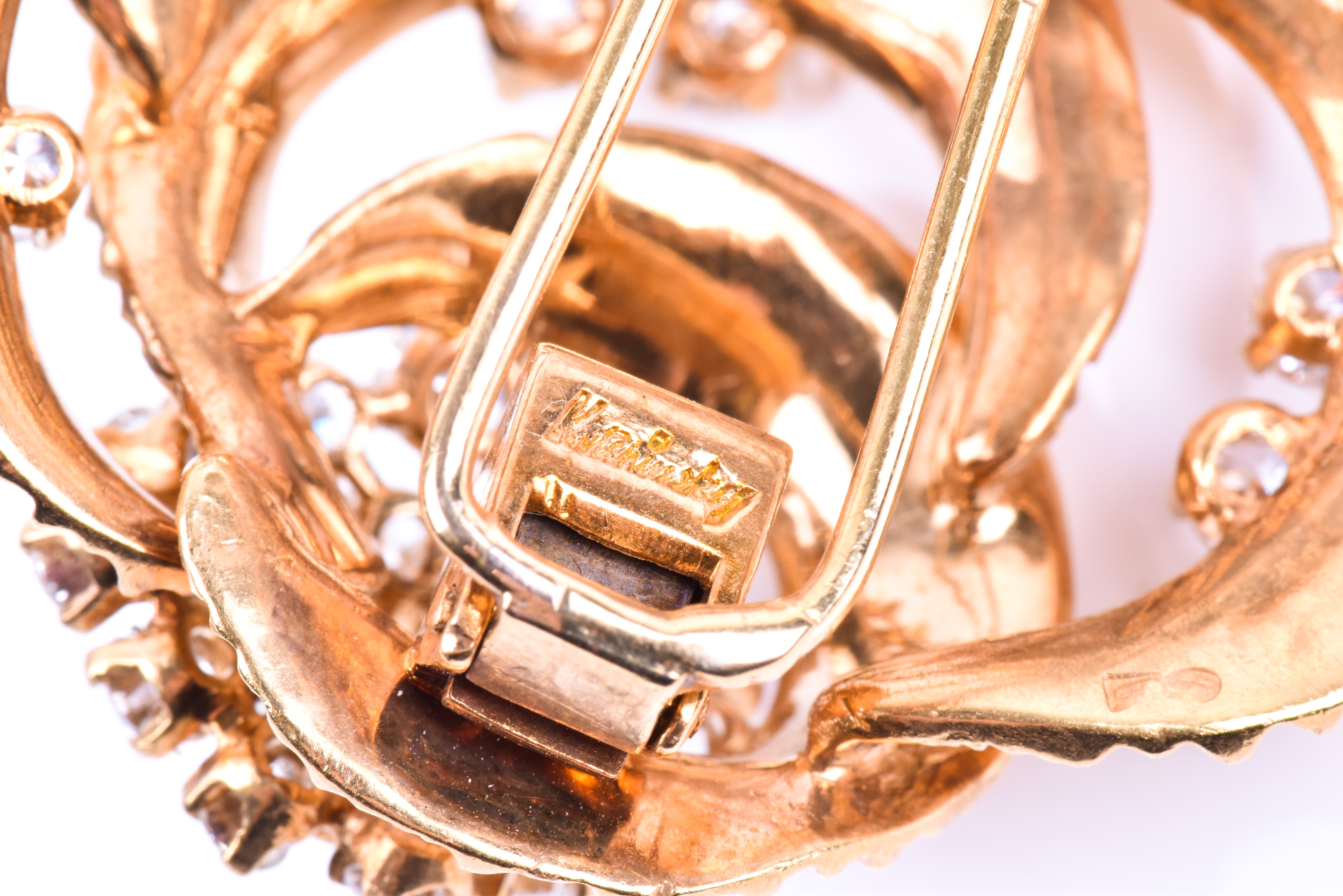 Lot 725 - Kutchinsky. A yellow gold and diamond brooch,