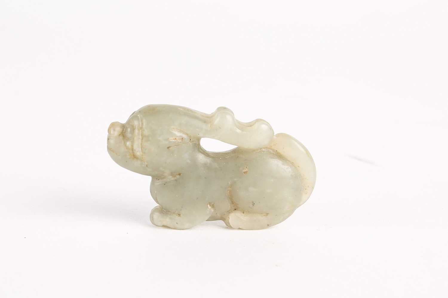 Lot 288 - A Chinese jade stag, Ming dynasty, in a