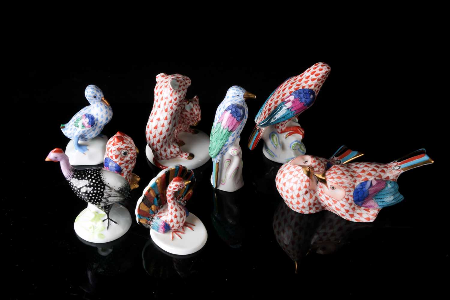 Lot 399 - A group of eight Herend porcelain figures,