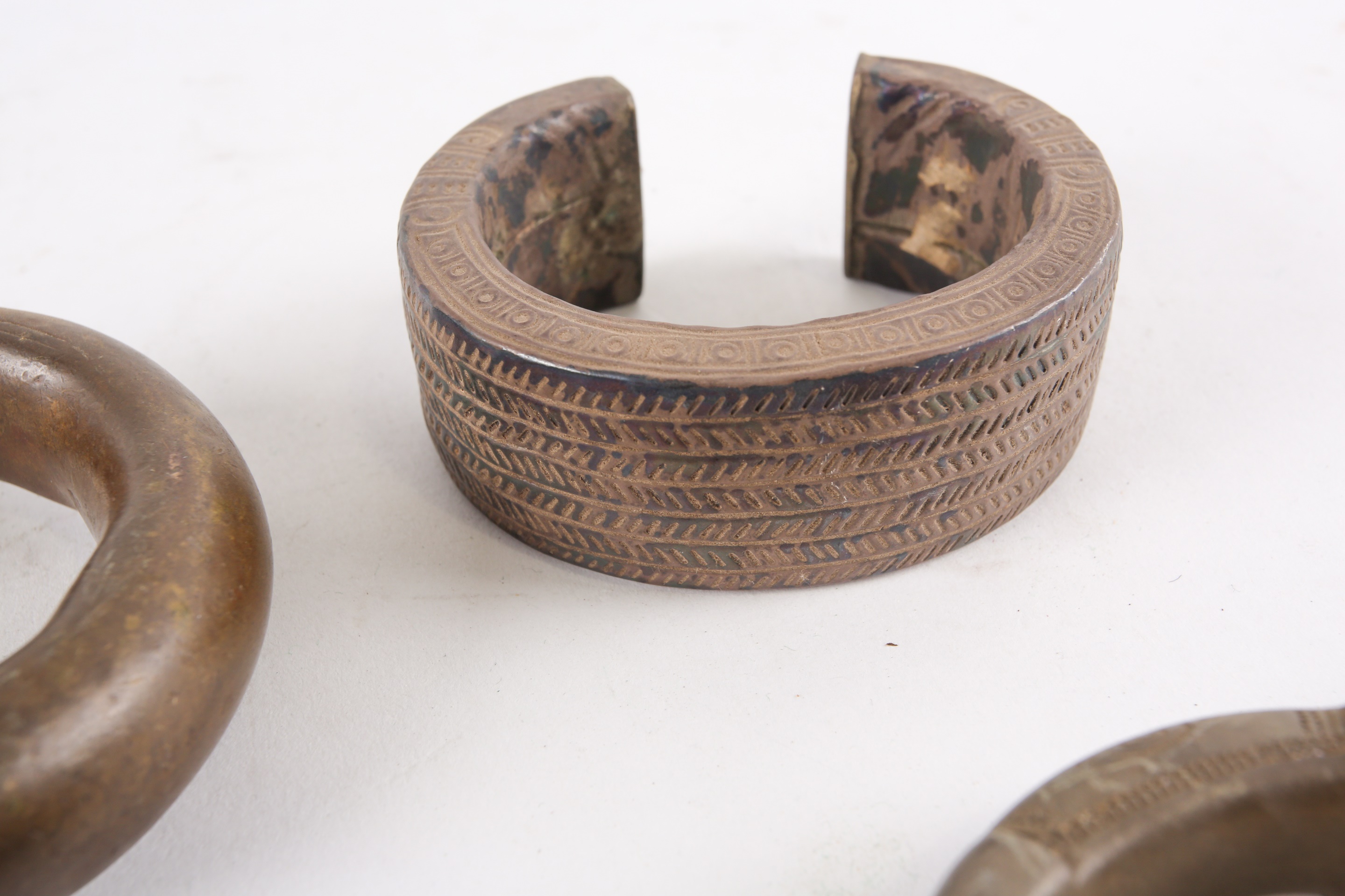 Lot 228 - Seven African bronze and brass Manillas,