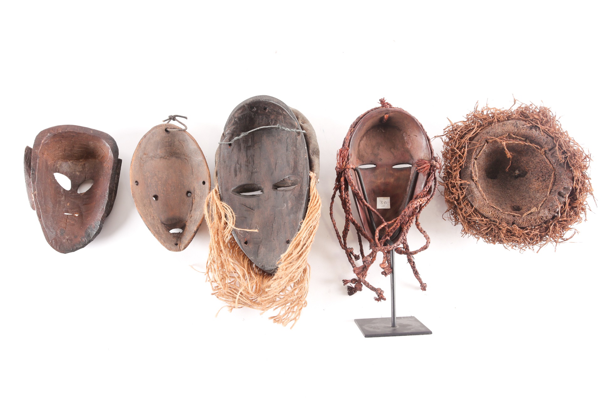 Lot 242 - Three Dan passport masks, Ivory coast, one