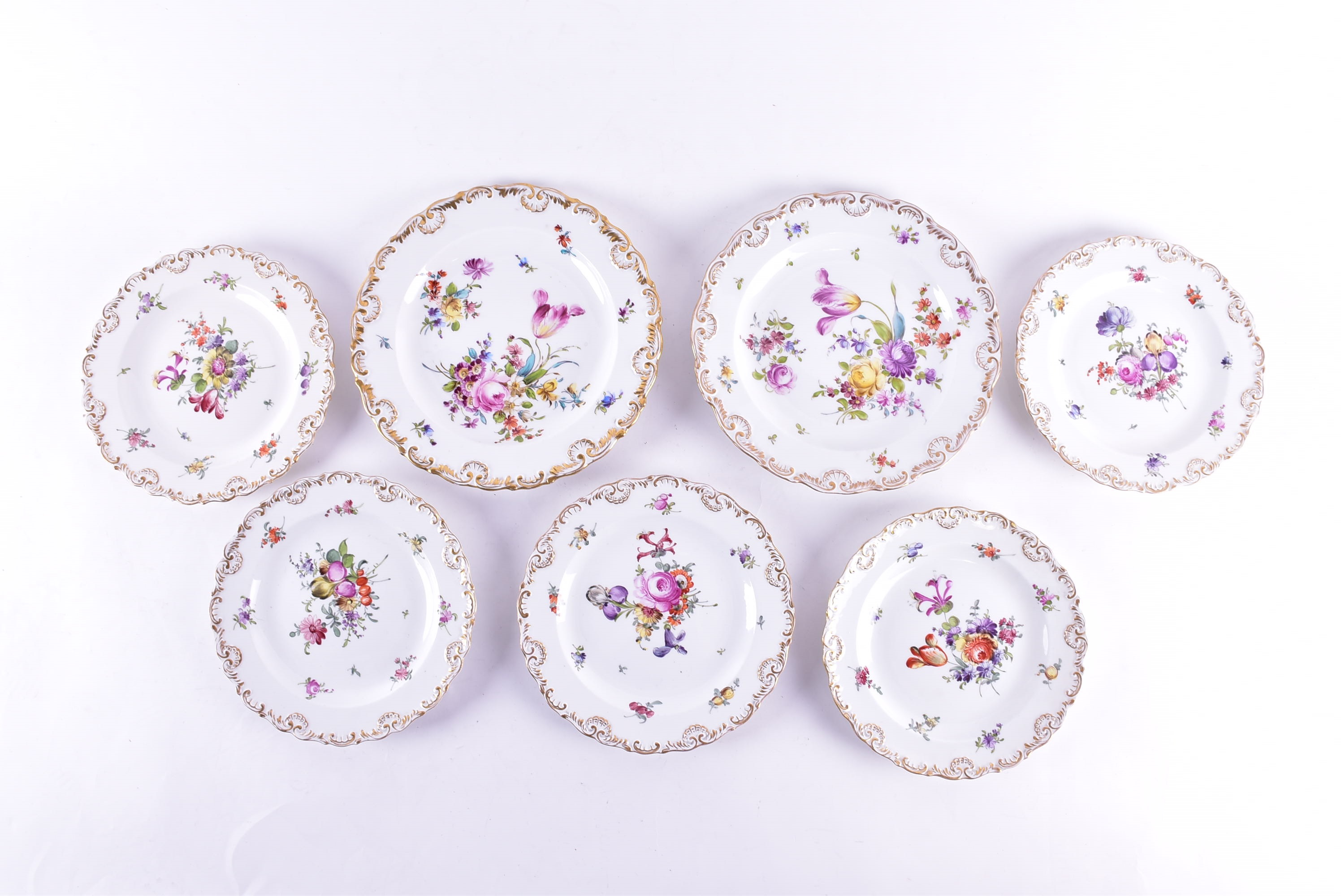 Lot 146 - A set of seven hand-painted Meissen plates,