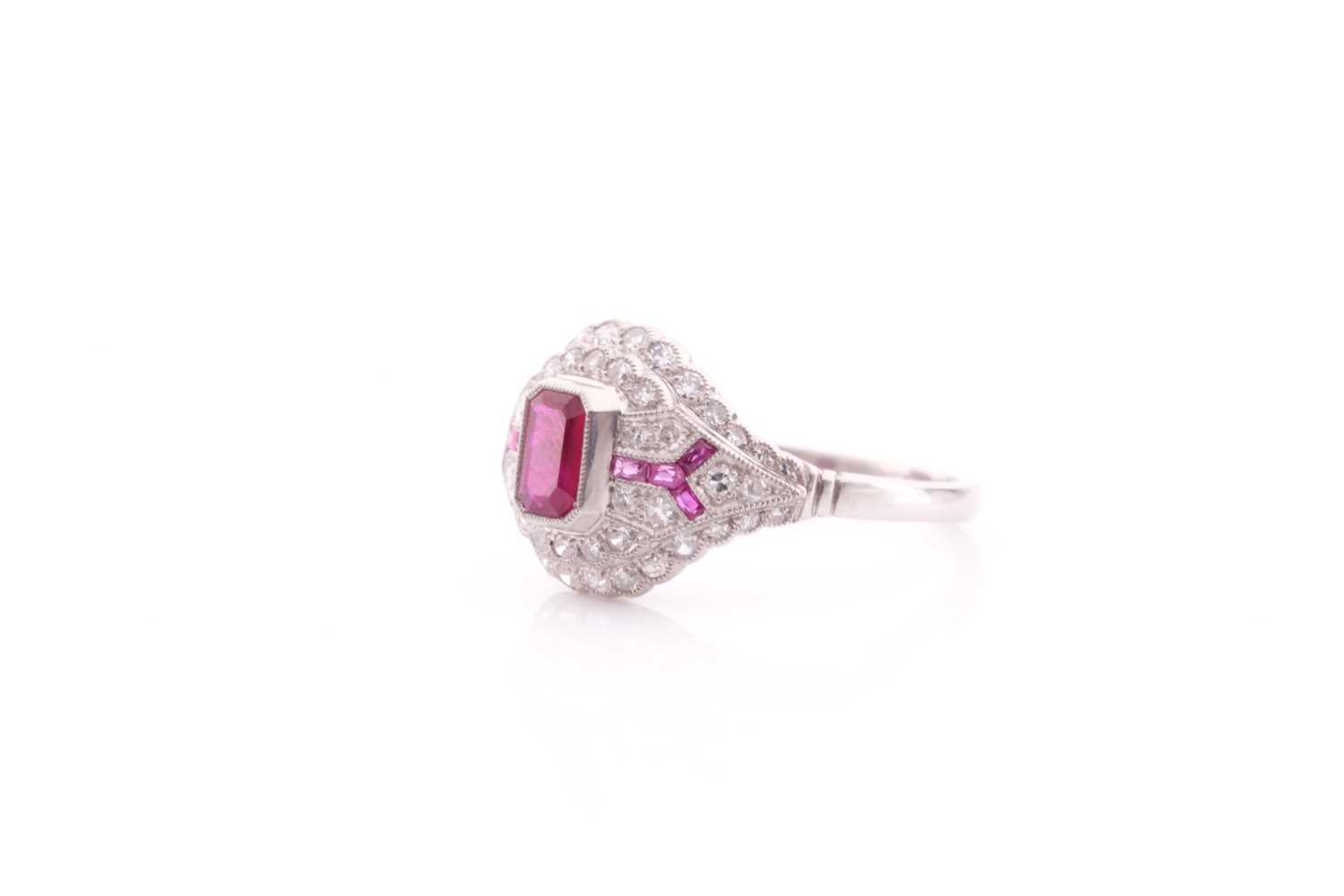 Lot 67 - An Art Deco diamond and ruby ring, inset with