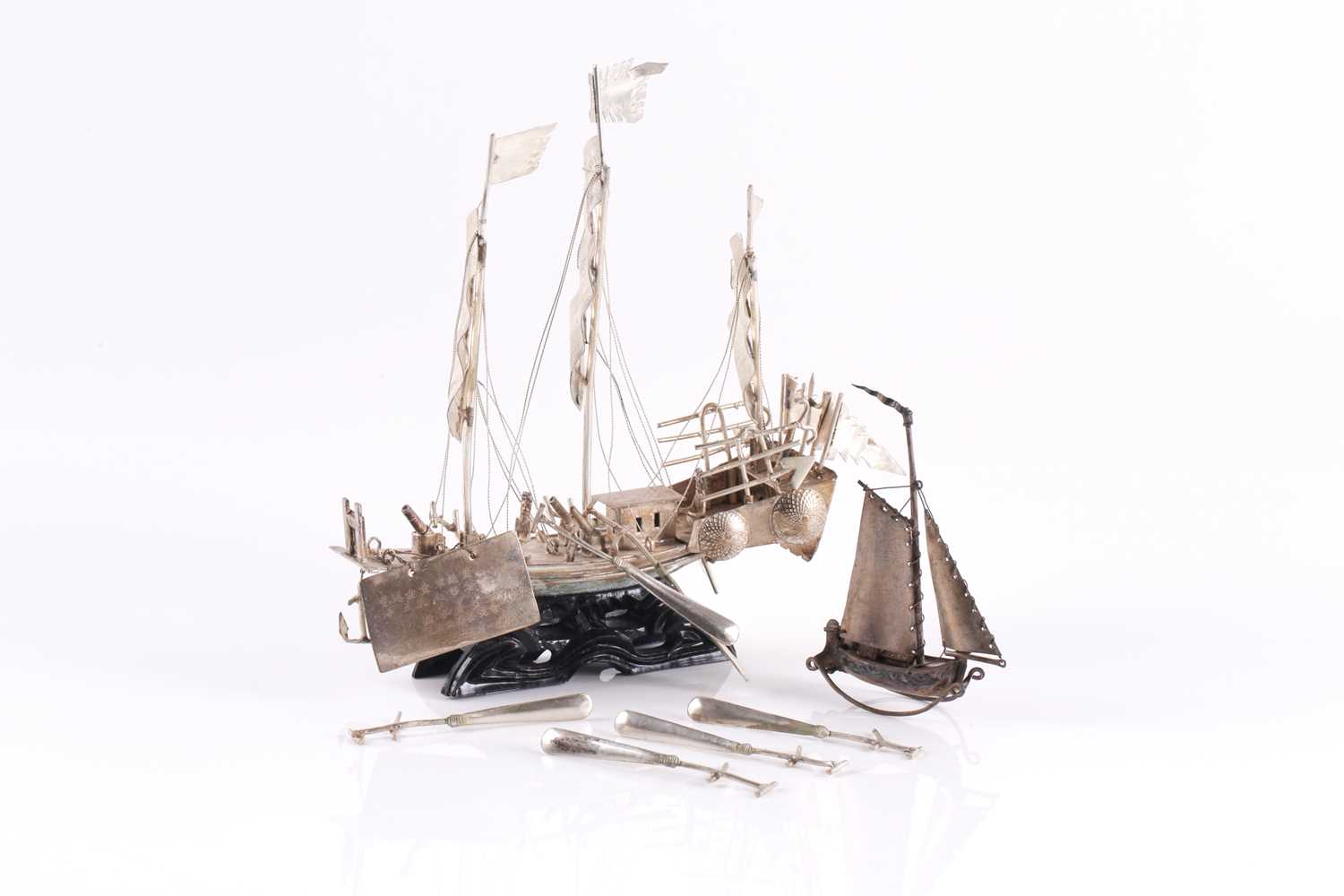 A Chinese silver model of an armed boat | Barnebys