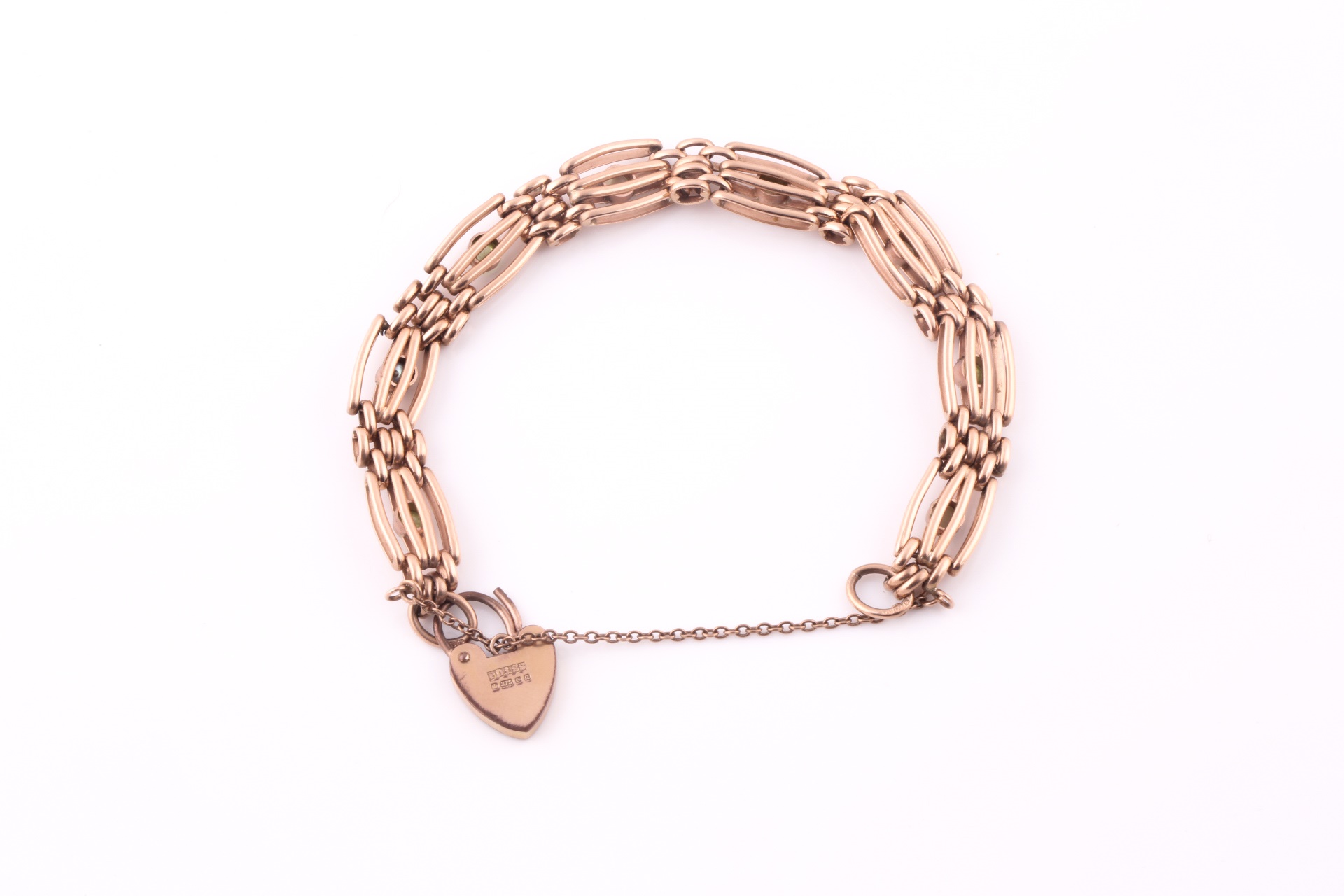 Lot 415 - 9ct yellow gold gate-link bracelet, set with