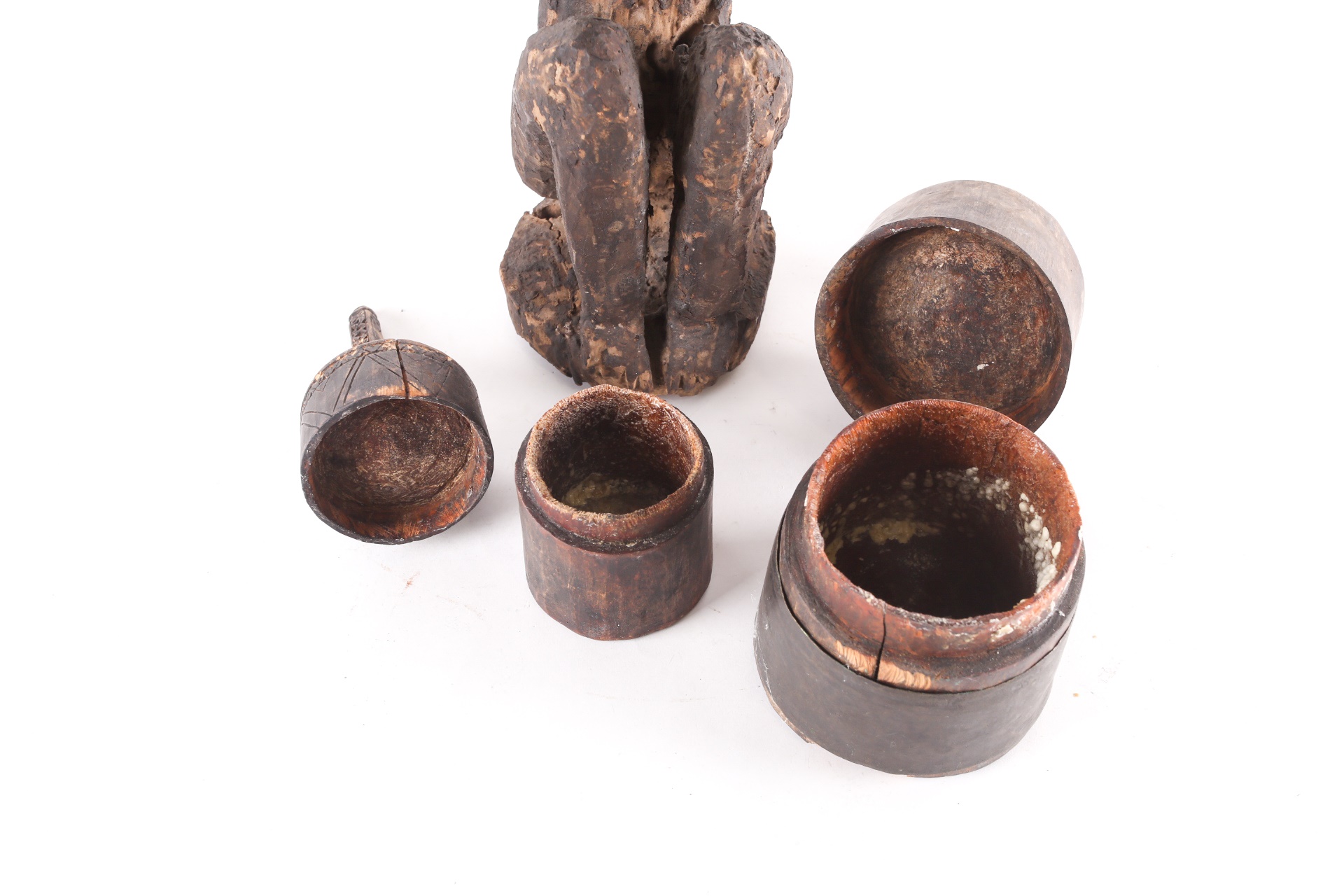 Lot 169 - A heavily encrusted Bonpo wood figure, Nepal,