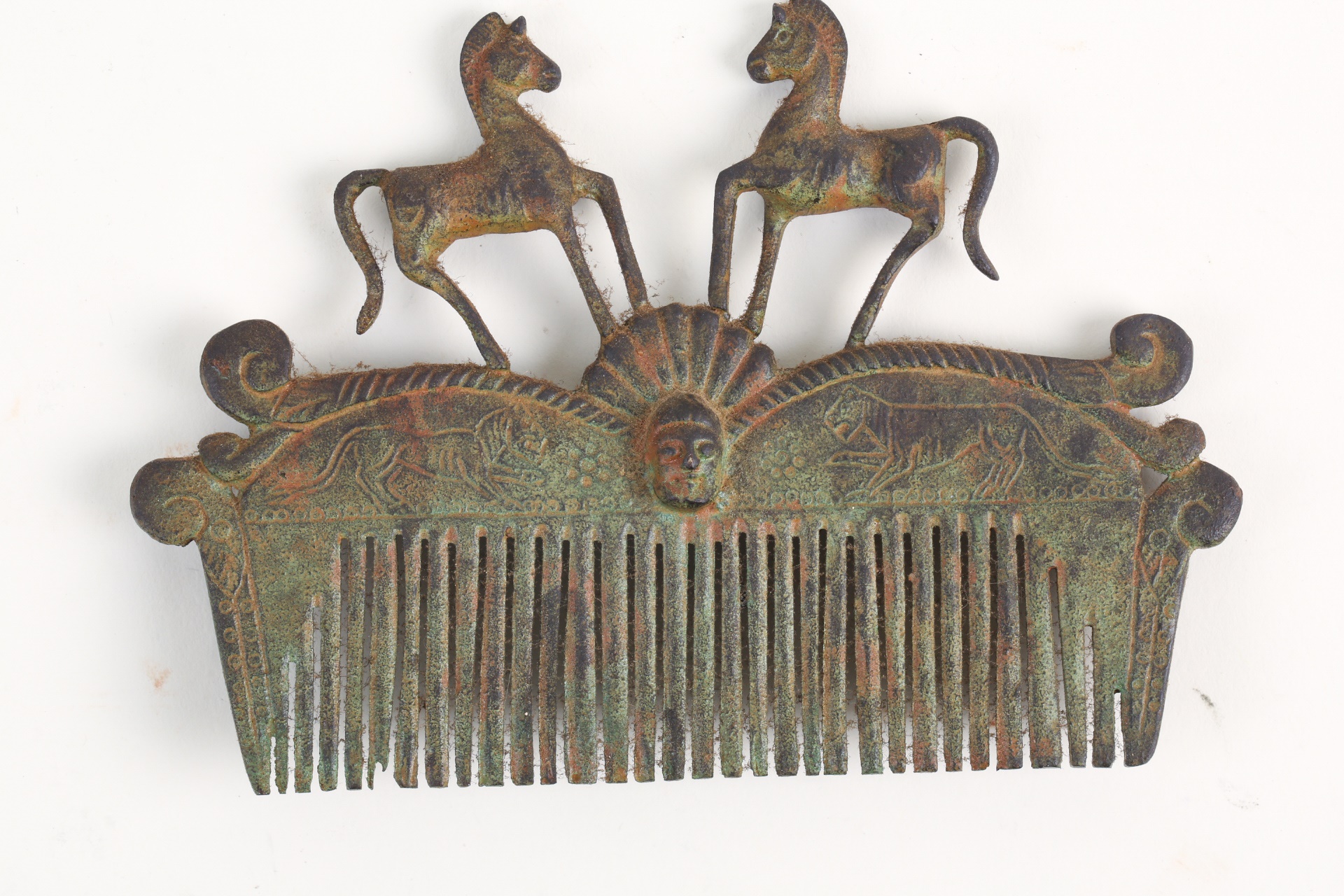 Lot 480 - A Roman-style verdigris bronze hair comb