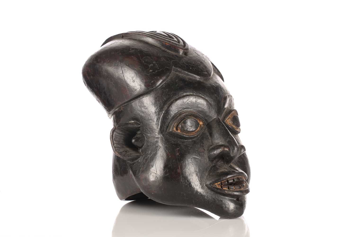 Lot 91 - A Bamun helmet mask, Cameroon, an elliptical