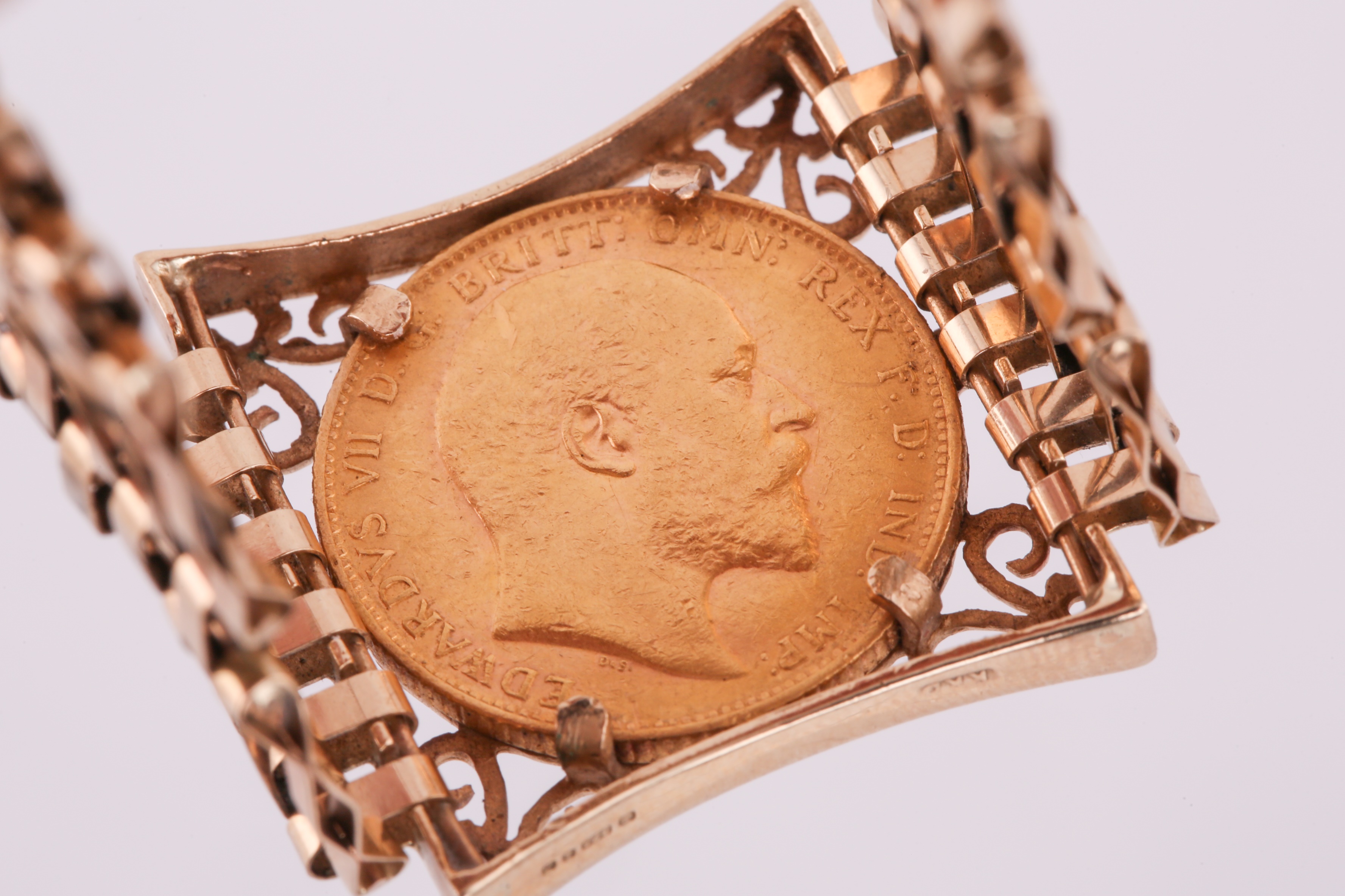 Lot 17 - A 9ct gold and full sovereign bracelet,