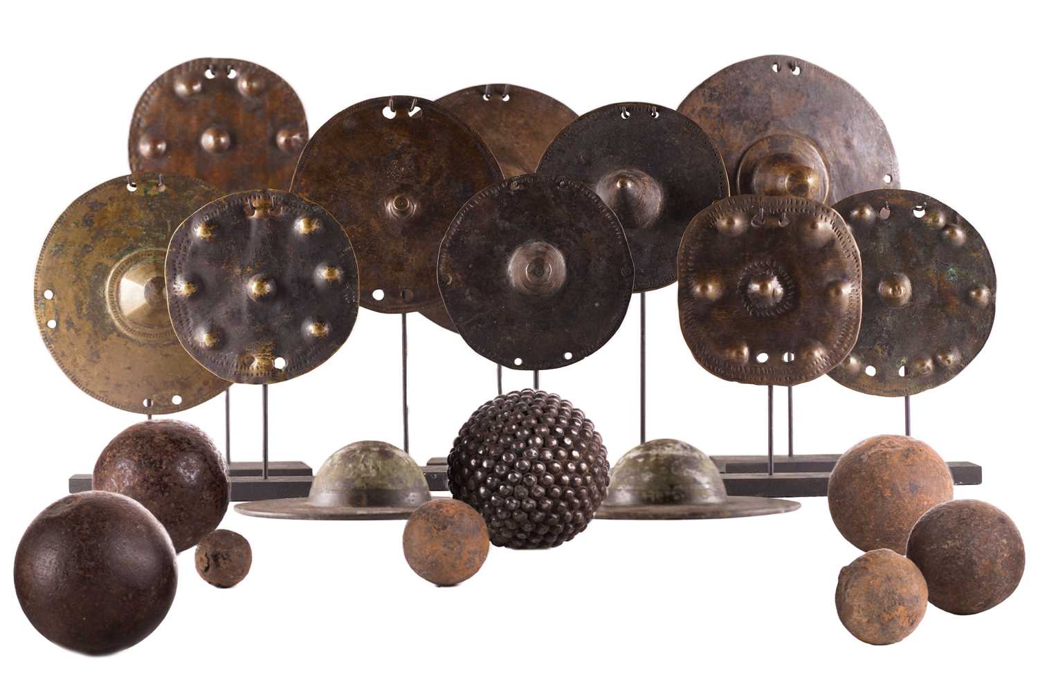 Lot 184 - A collection of twelve bronze shield bosses,