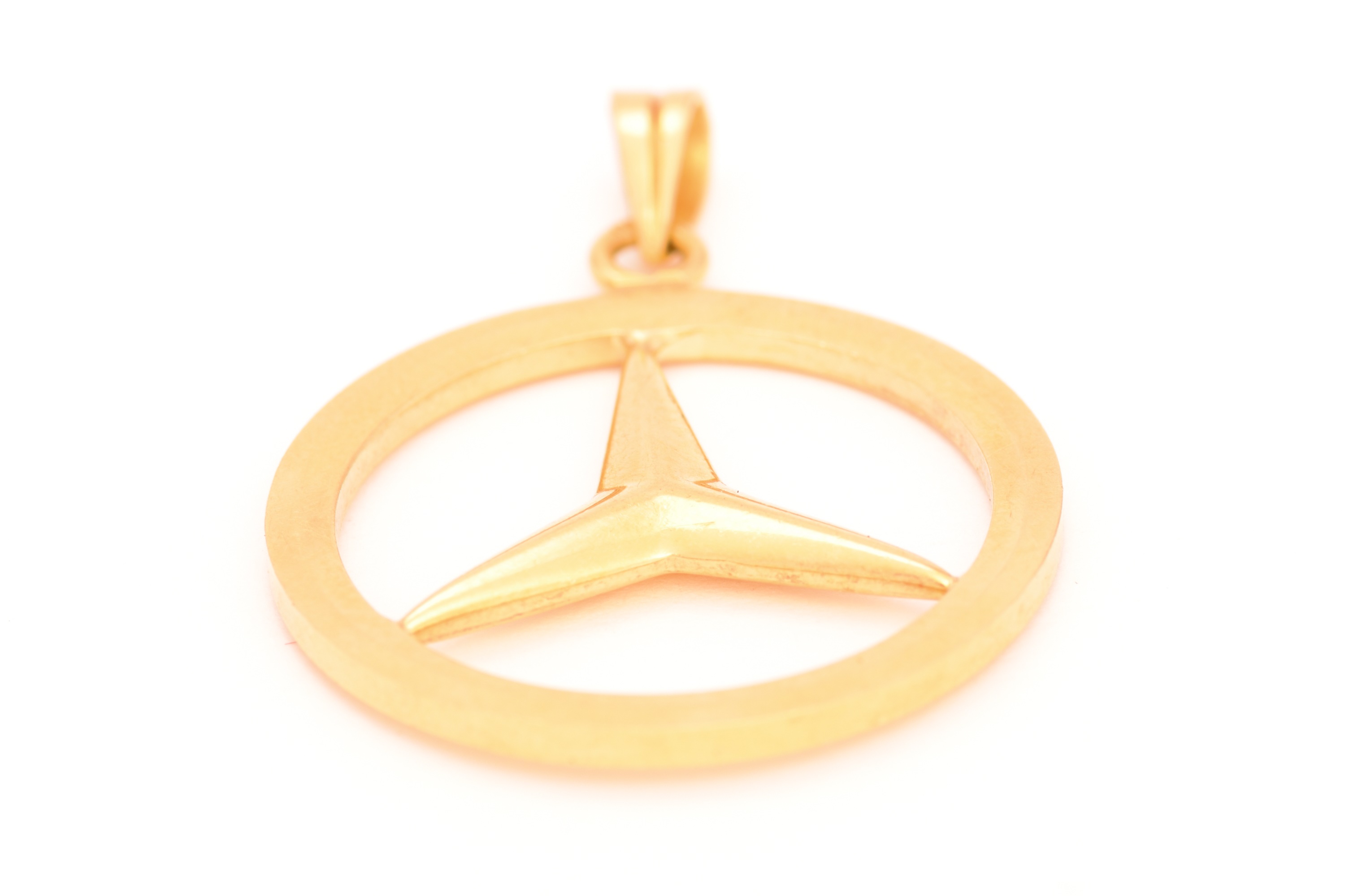 Lot 88 - A Mercedes-Benz logo pendant, featuring the
