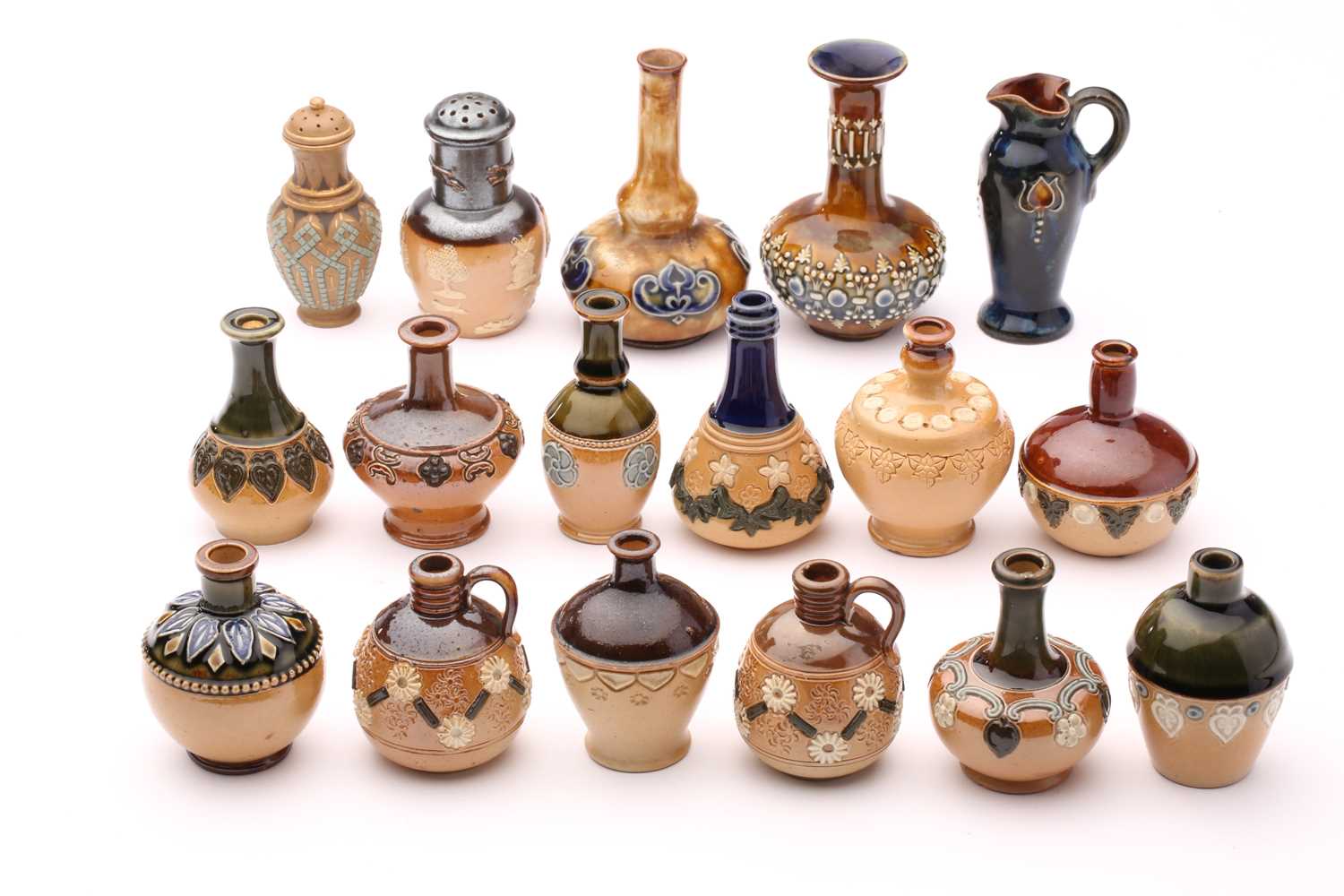 Lot 113 - Seventeen Doulton stoneware miniature vases,