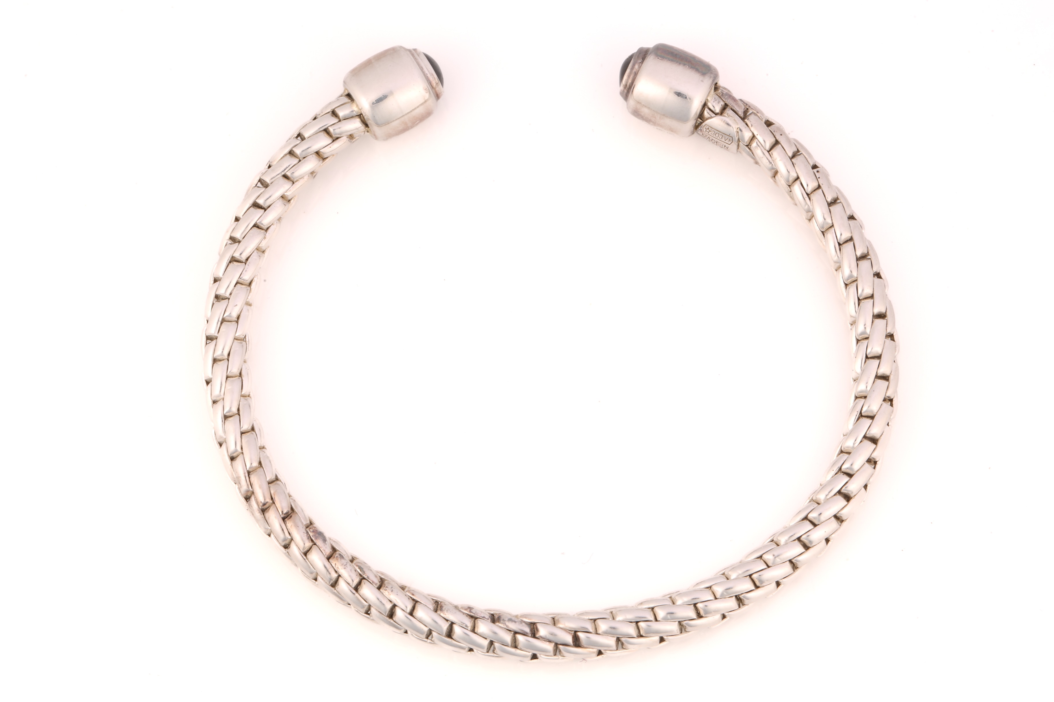 Lot 29 - FOPE - A Silver Fope bangle with sapphires