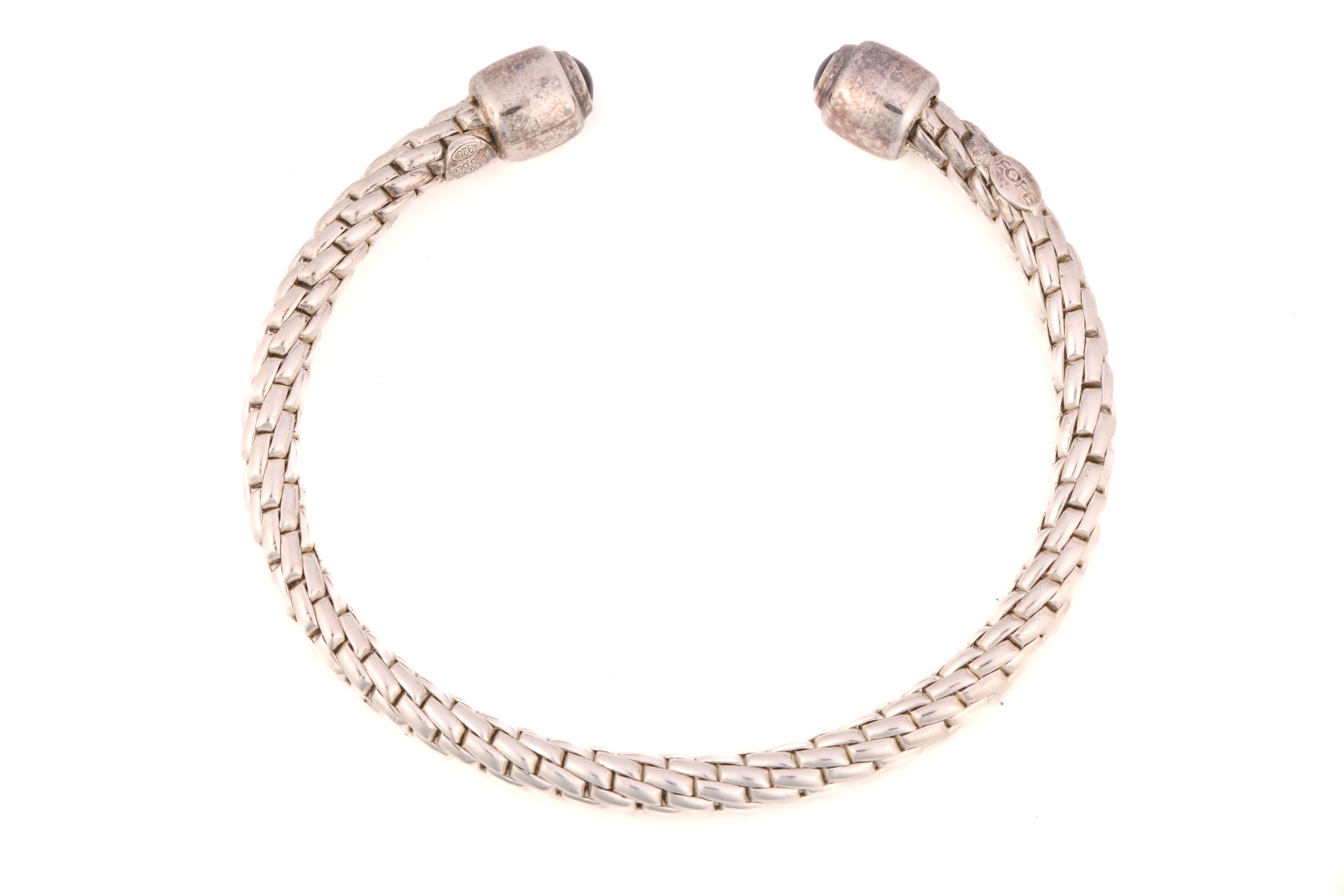 Lot 29 - FOPE - A Silver Fope bangle with sapphires