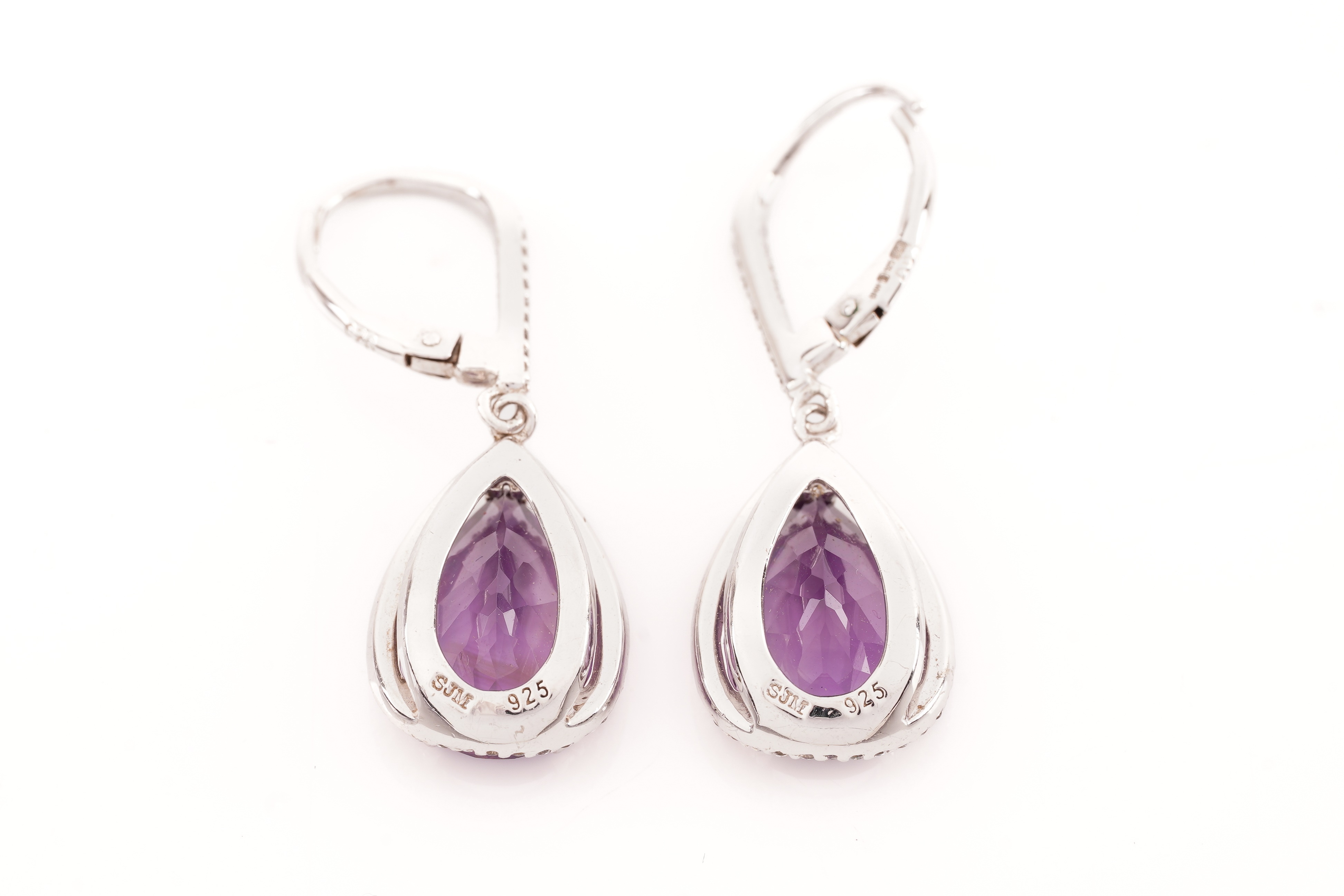 Lot 15 - A pair of amethyst and cubic zirconia pendant