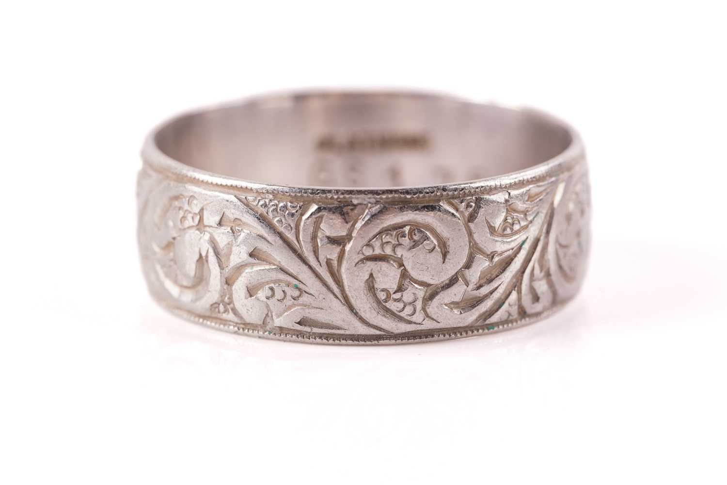 Lot 262 - An engraved wedding band, the D-section band
