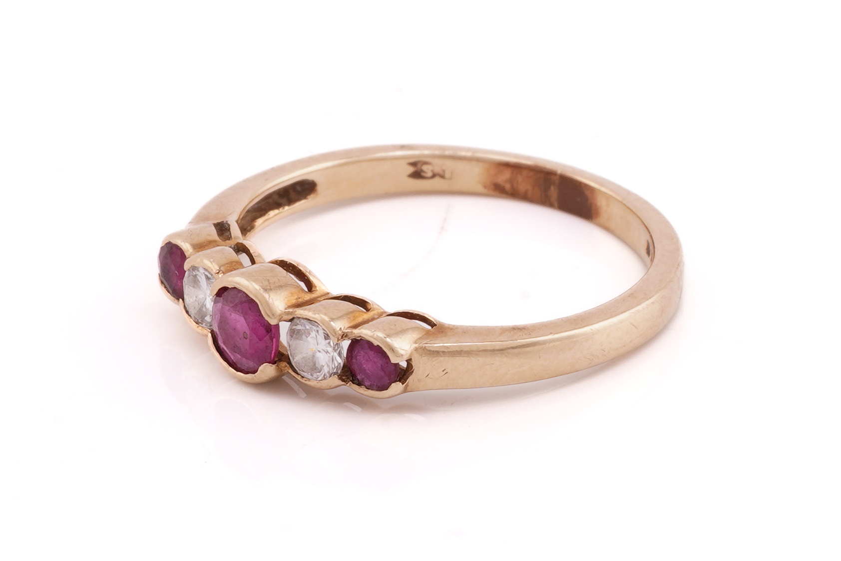 Lot 358 - A five stone ruby and diamond half hoop ring,