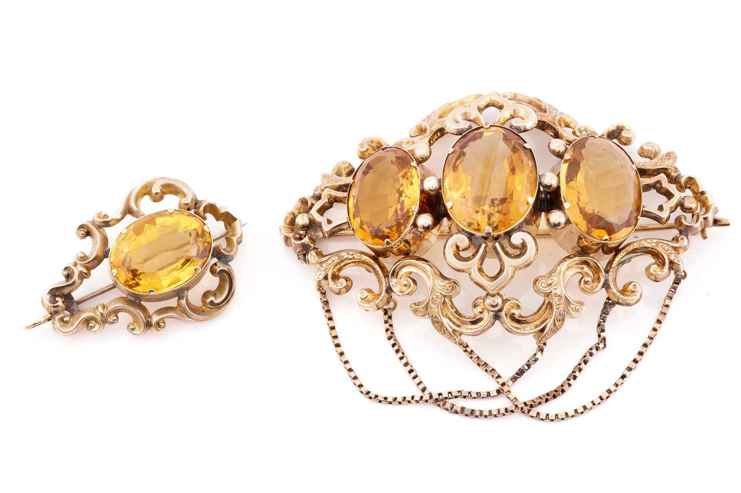 Lot 256 - A late Victorian three stone citrine brooch;
