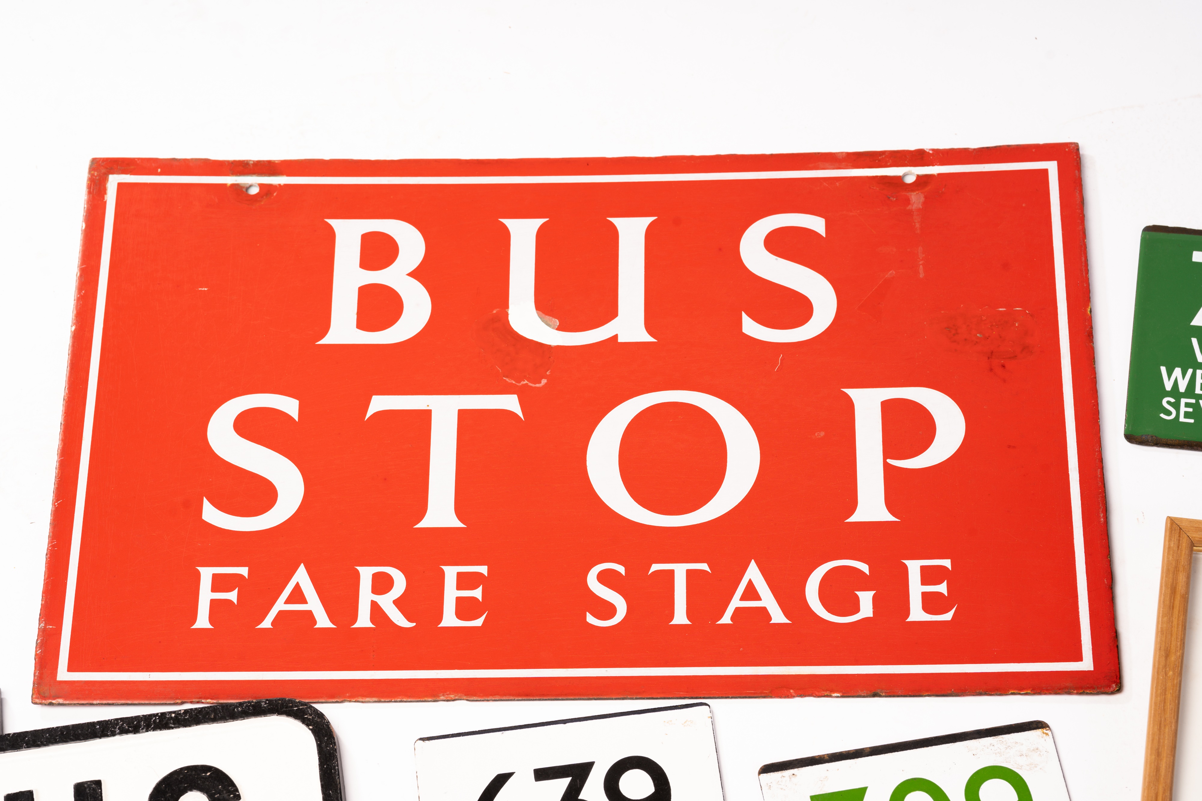 Lot 403 - Two vintage cast iron Bus Stop signs, the