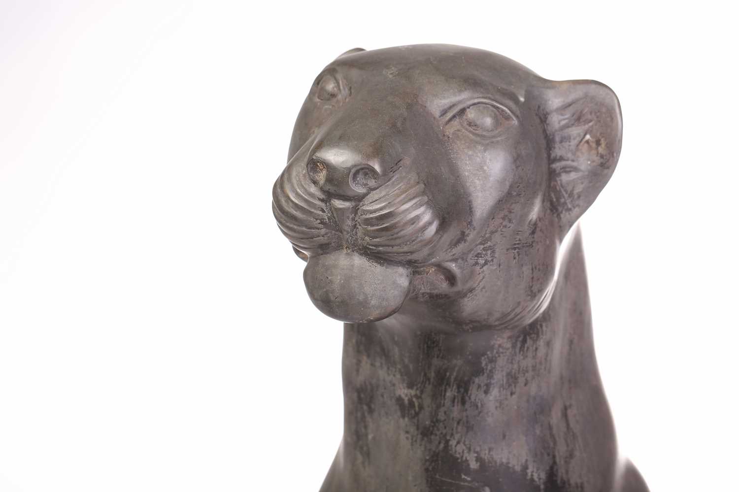 Lot 310 - A pair of seated almost life-size bronze