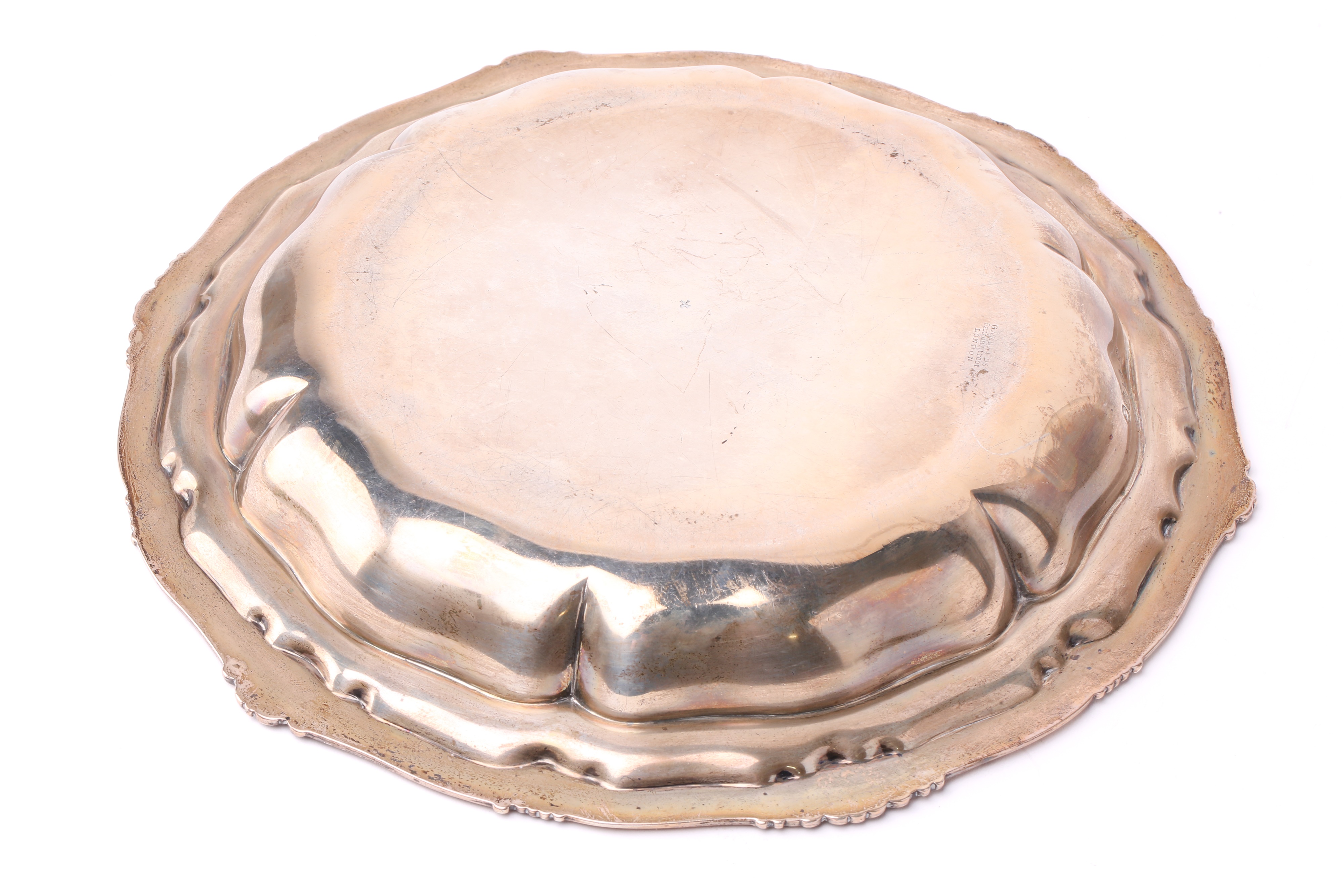 Lot 394 - A Victorian silver pie-crust shaped dish, by