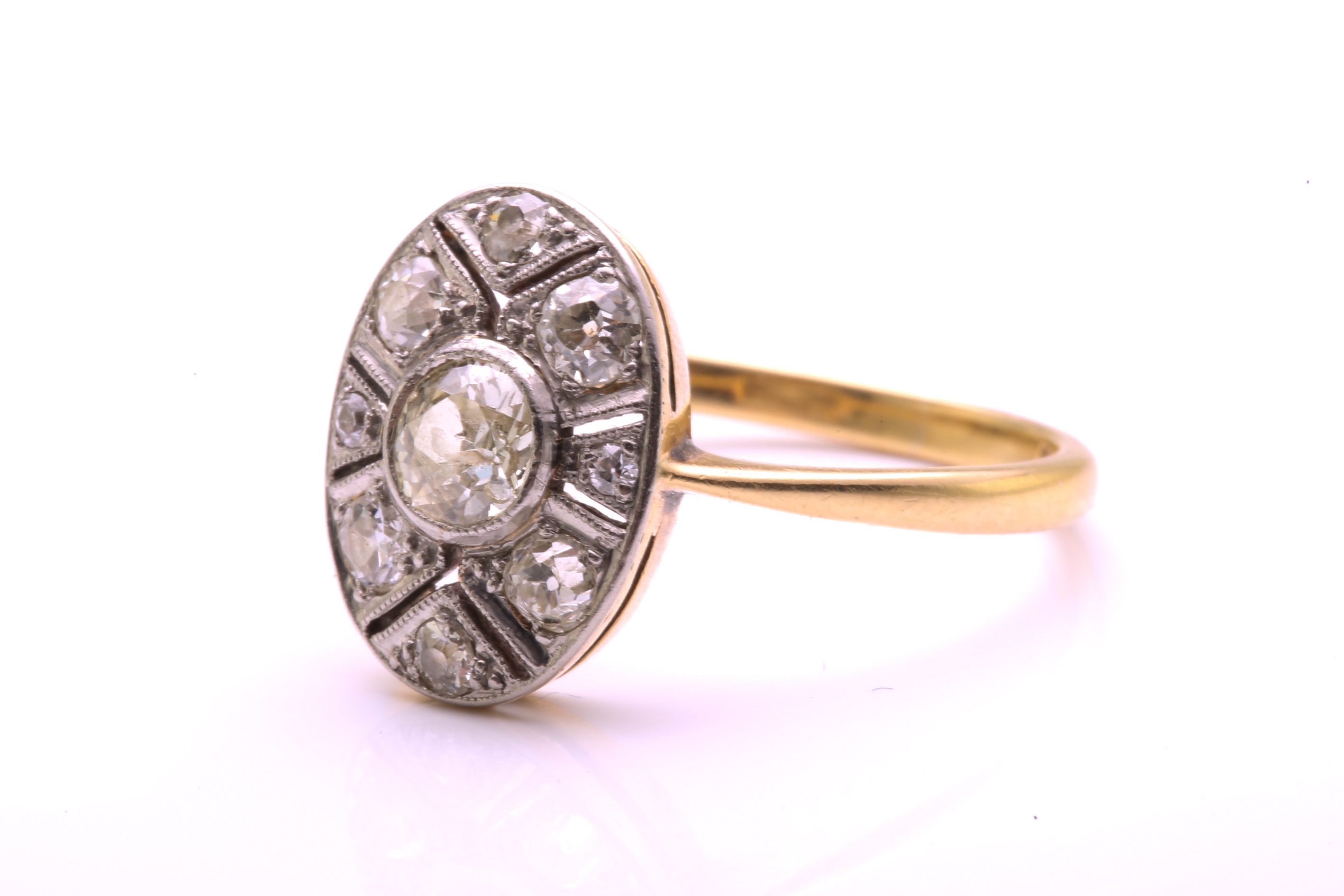 Lot 20 - An Art Deco diamond panel ring, the oval