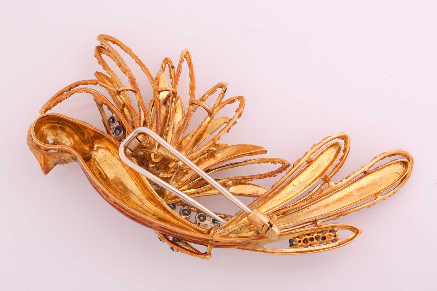 Lot 22 - A sapphire and diamond phoenix brooch set in