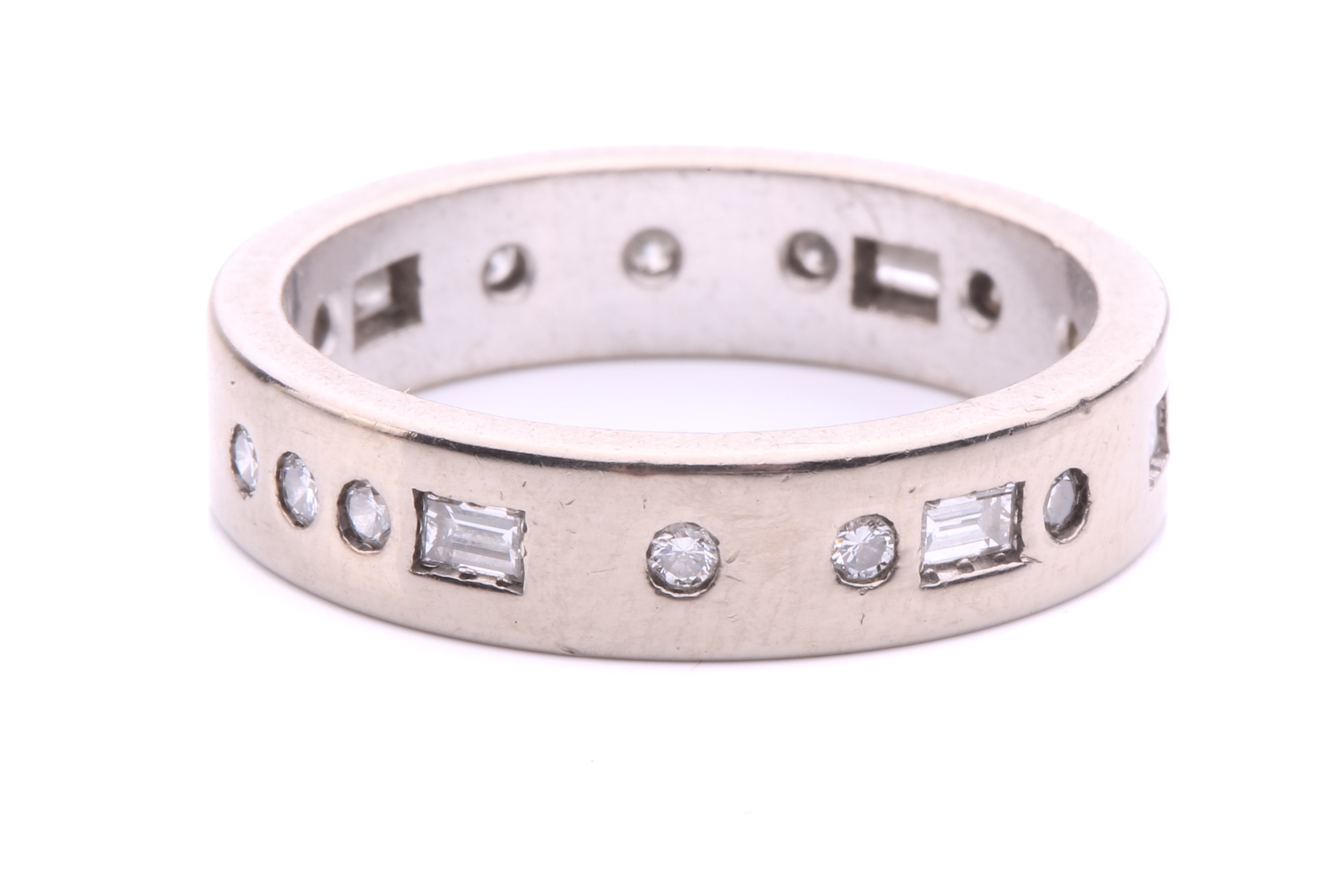 Lot 83 - A diamond ring of morse code design,