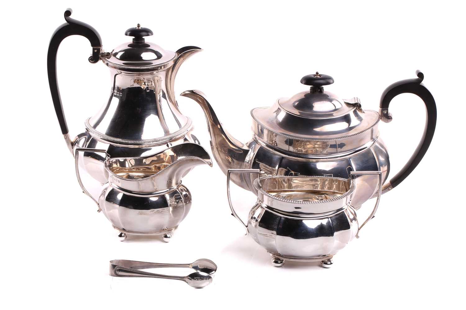 Lot 432 - A four-piece silver teaset, oval with ovolo
