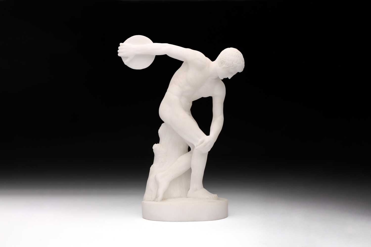 Lot 415 - A classical white carved alabaster figure of