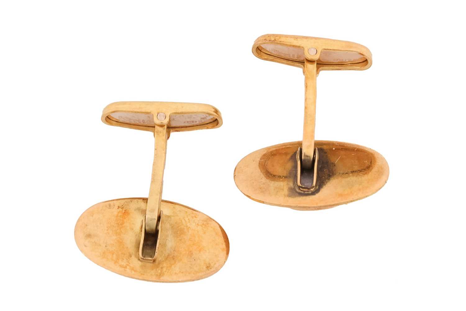 Lot 12 - A pair of emerald cufflinks, each set with an
