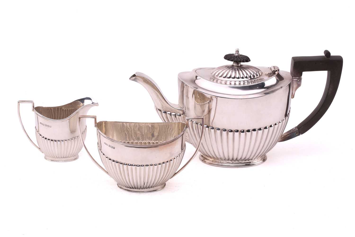 Lot 484 - A George IV-style three-piece silver tea set,