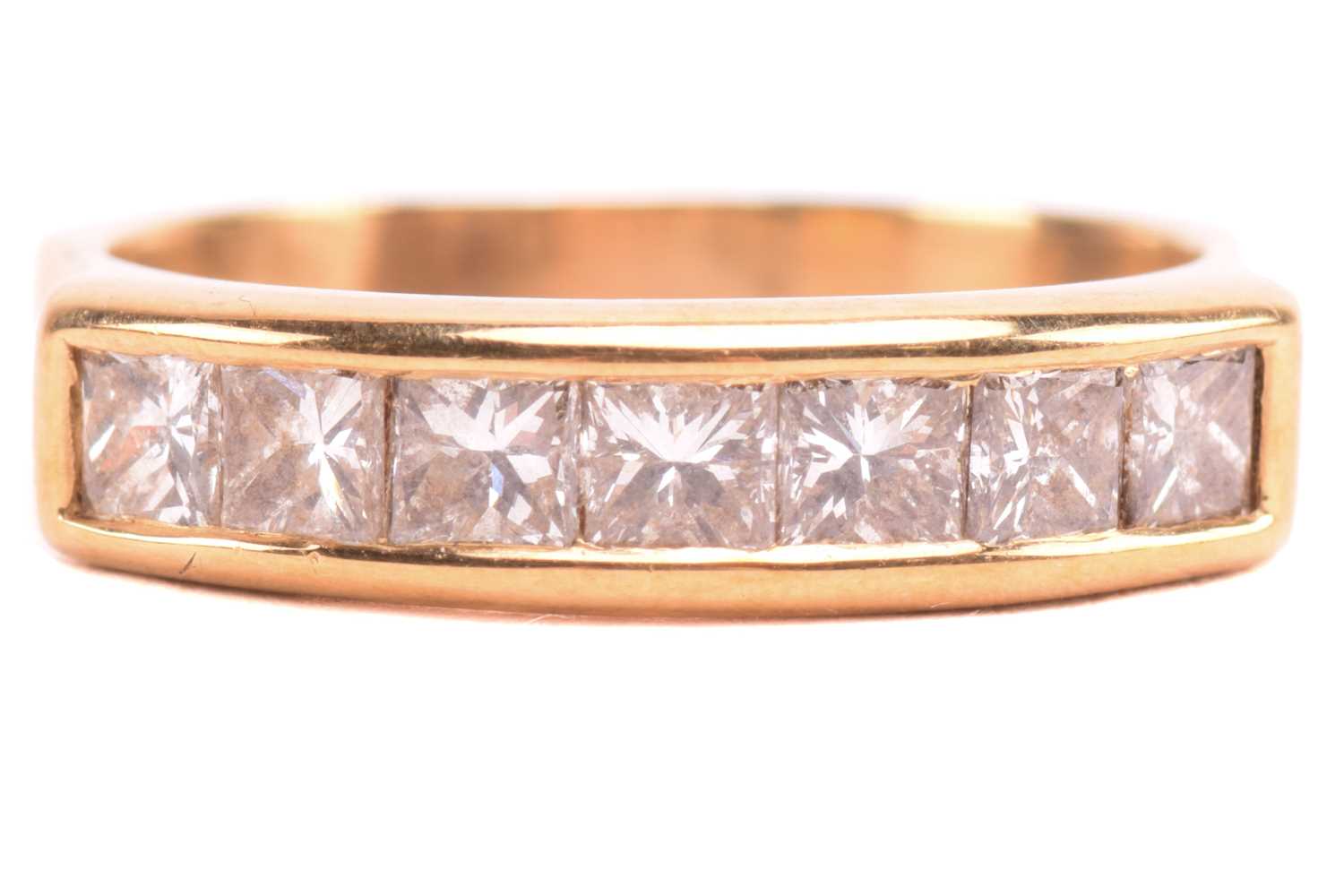 Lot 138 - A diamond half hoop ring, set with a row of