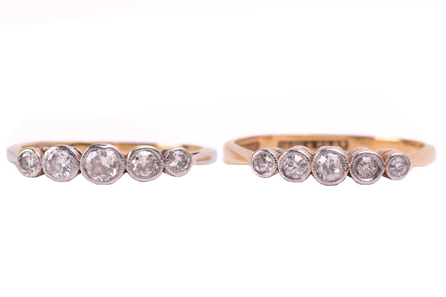 Lot 266 - Two diamond five stone rings, the first set