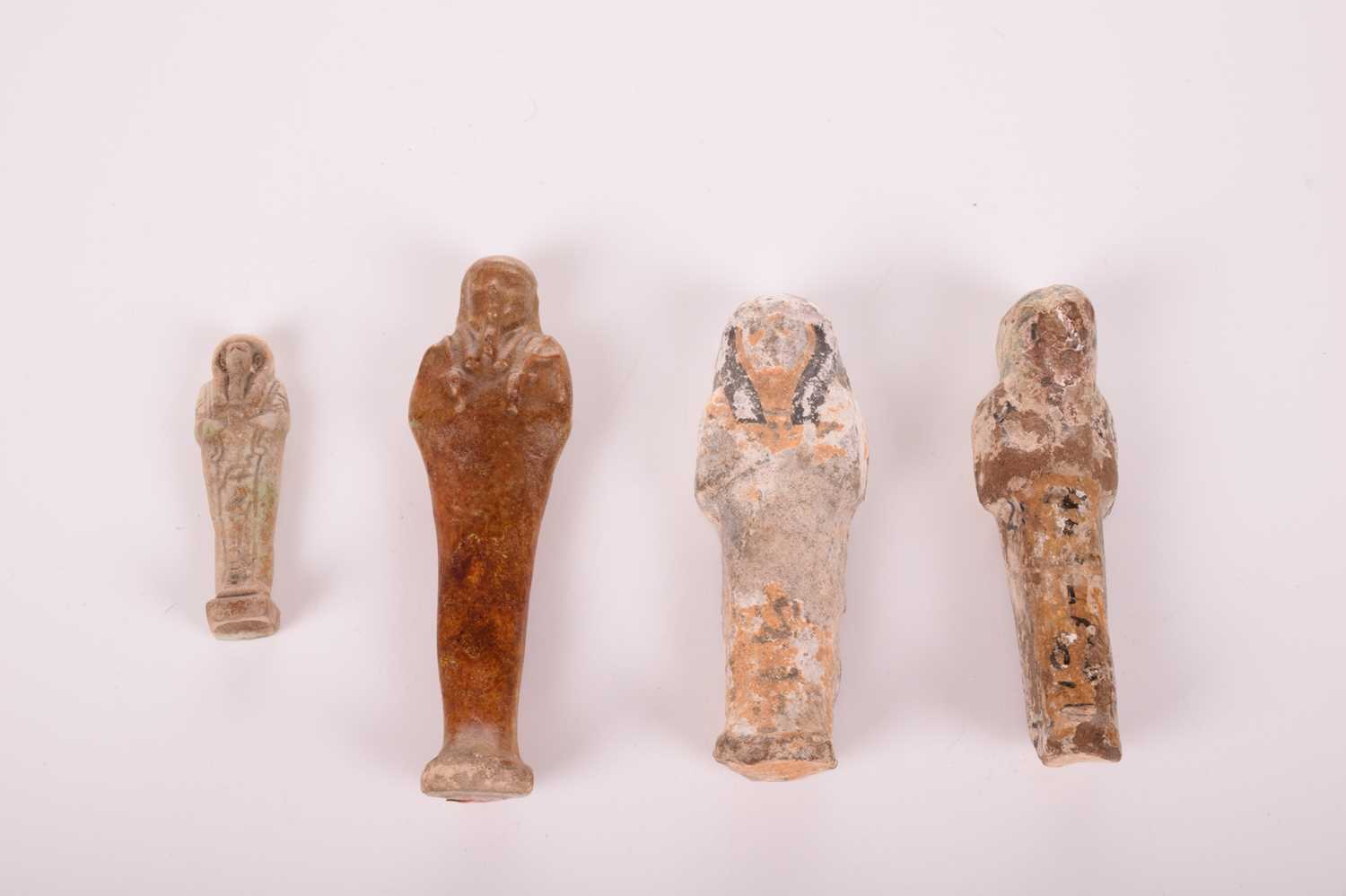Lot 245 - An Egyptian faience shabti with signs of