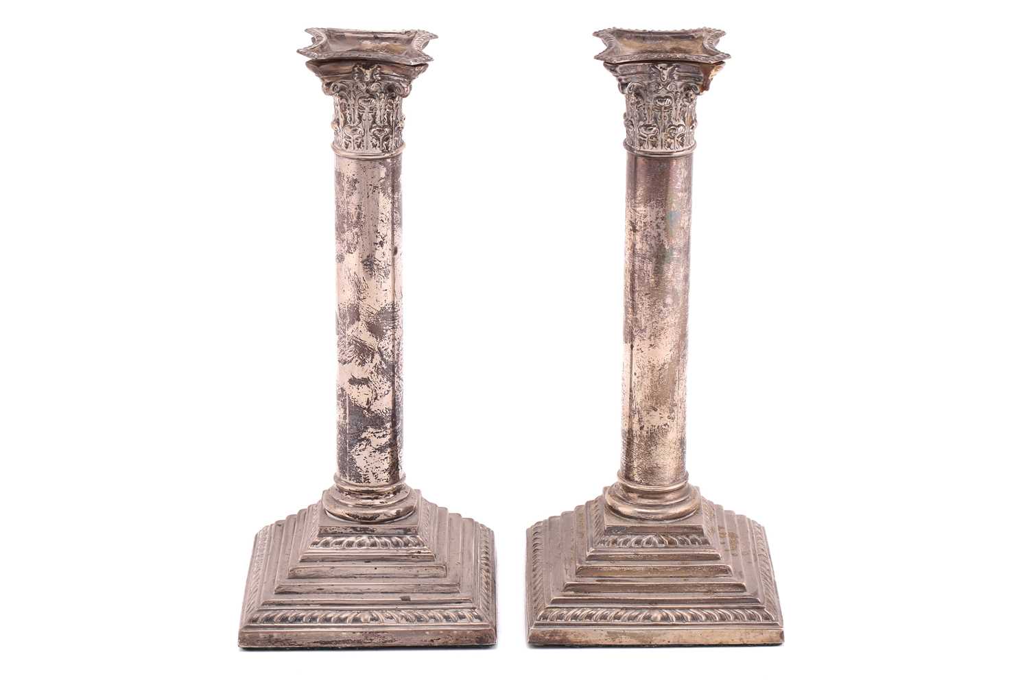Lot 414 - A pair of column candlesticks, with