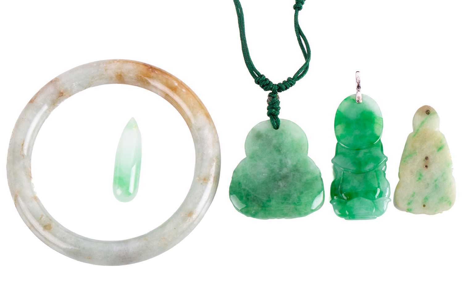 Lot 129 - A Chinese jade bangle and other four carved
