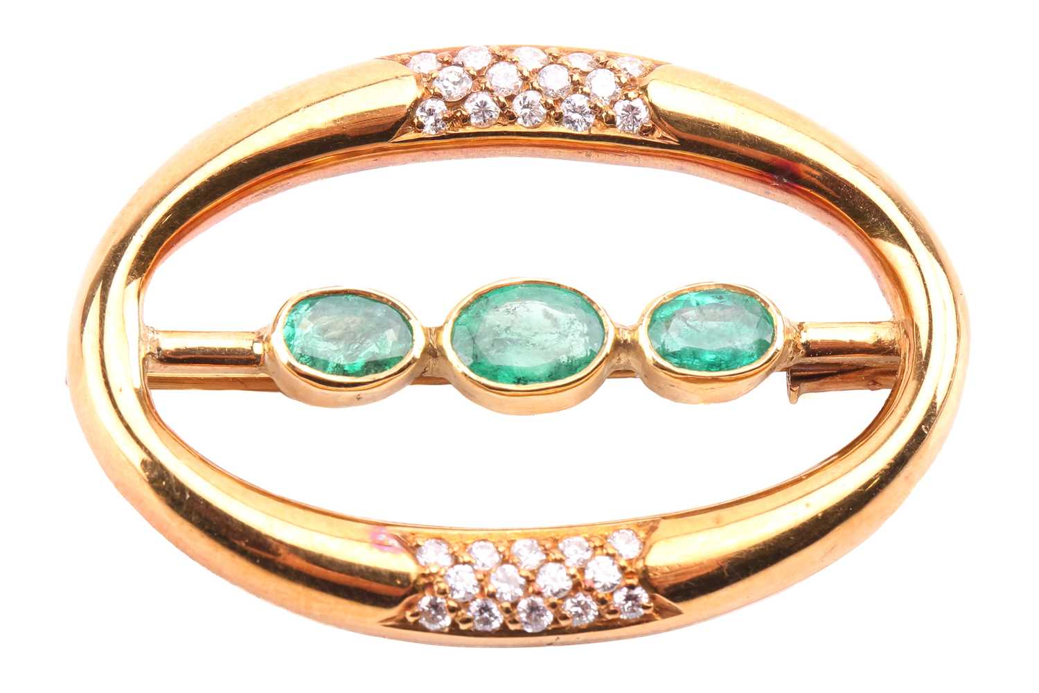 Lot 131 - An emerald and diamond open oval brooch in